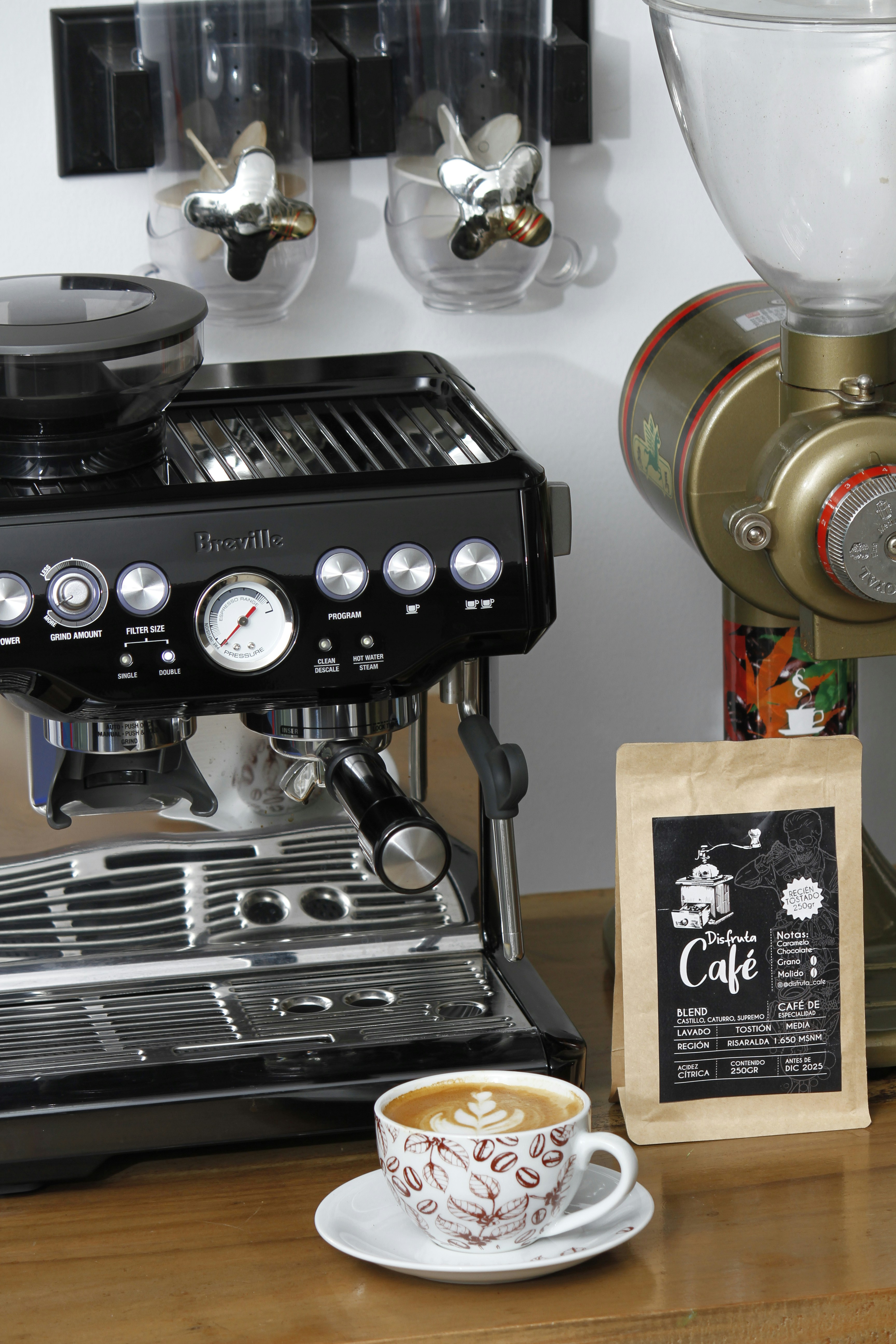 A cup of coffee sitting next to a coffee maker photo – Free Coffee ...