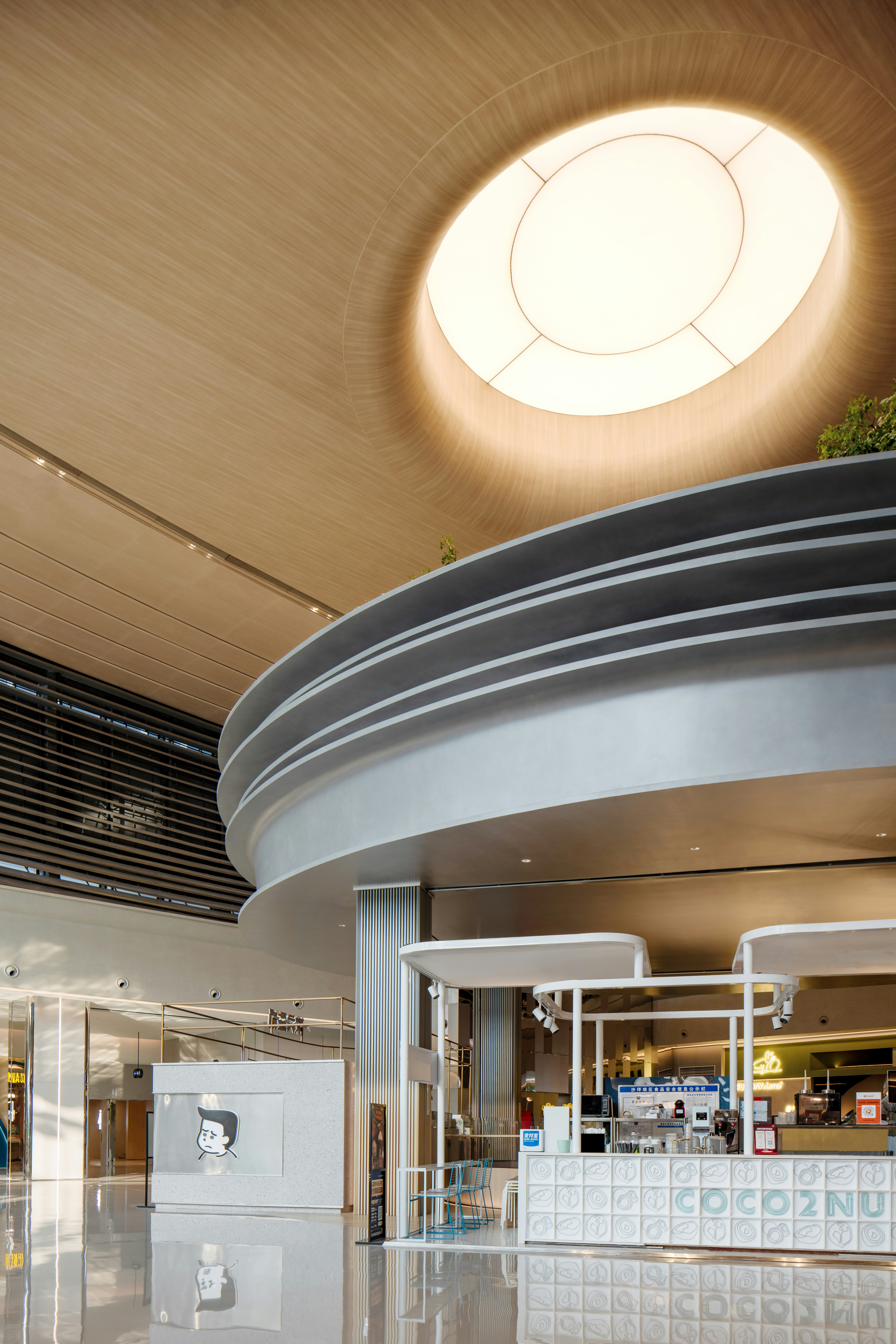 A large circular building with a skylight above it photo – Free ...