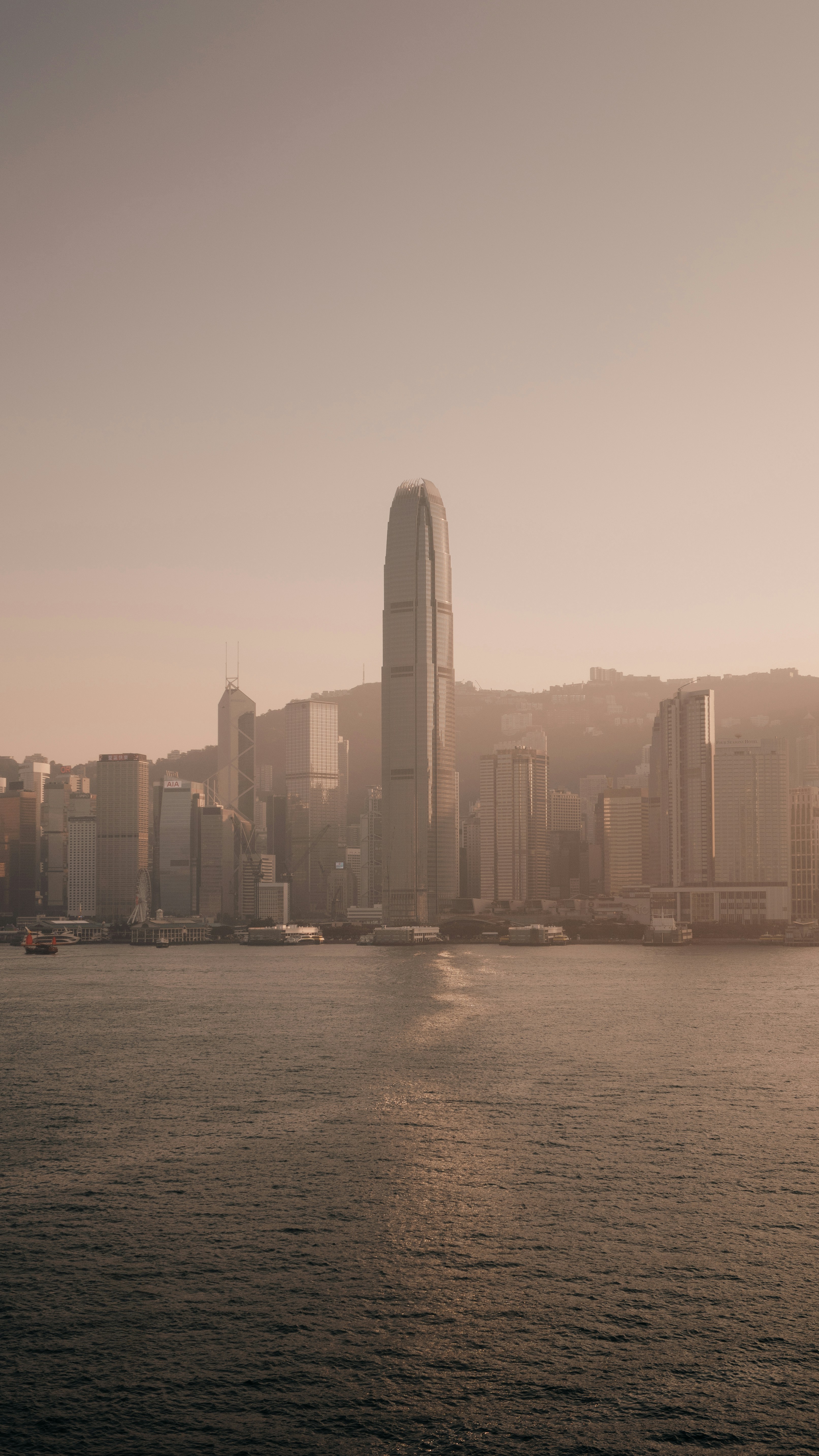 Sepia Twilight over Victoria Harbour: The ICC Crowned by Mist