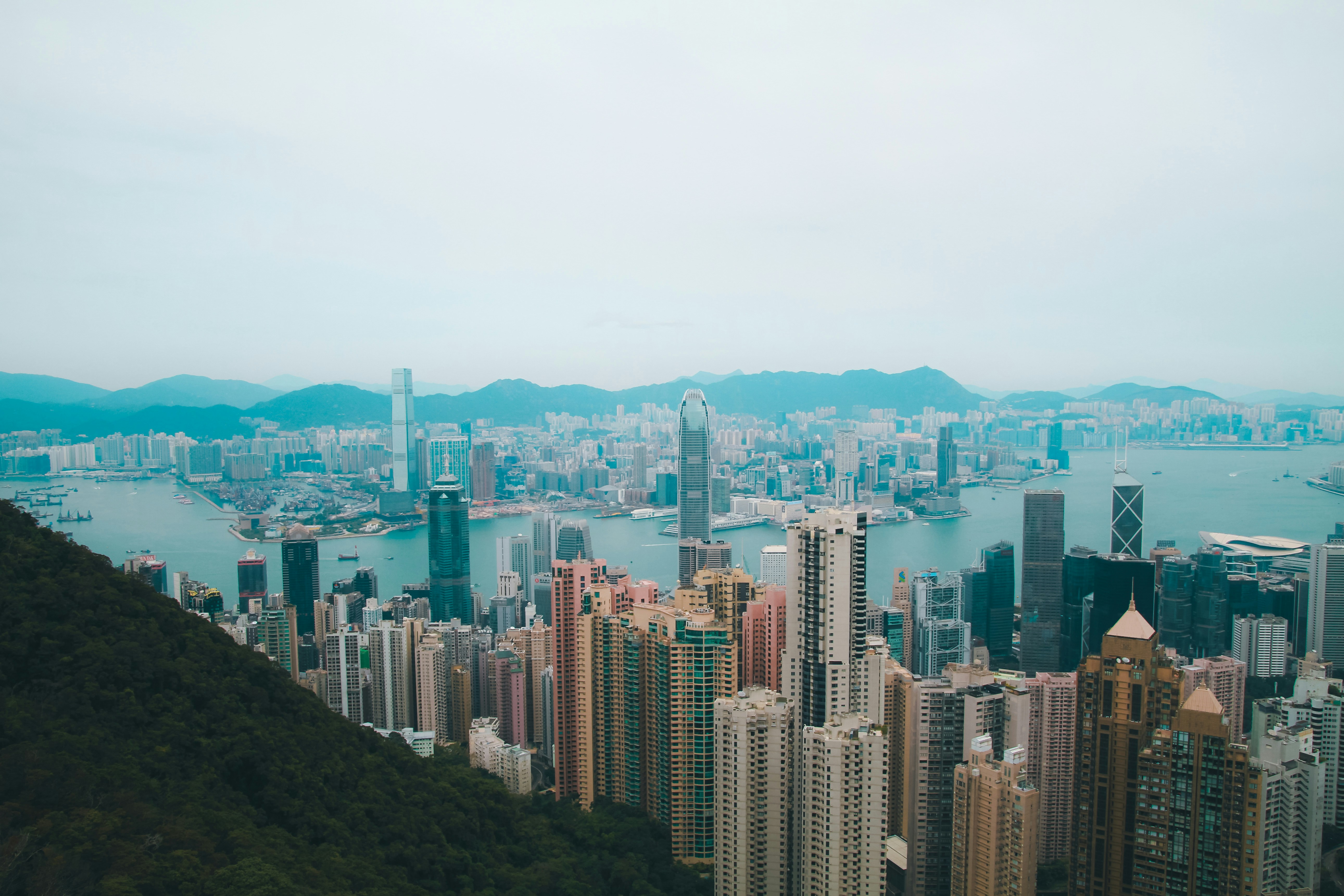 A view of a city from the top of a hill photo – Free Building Image on ...