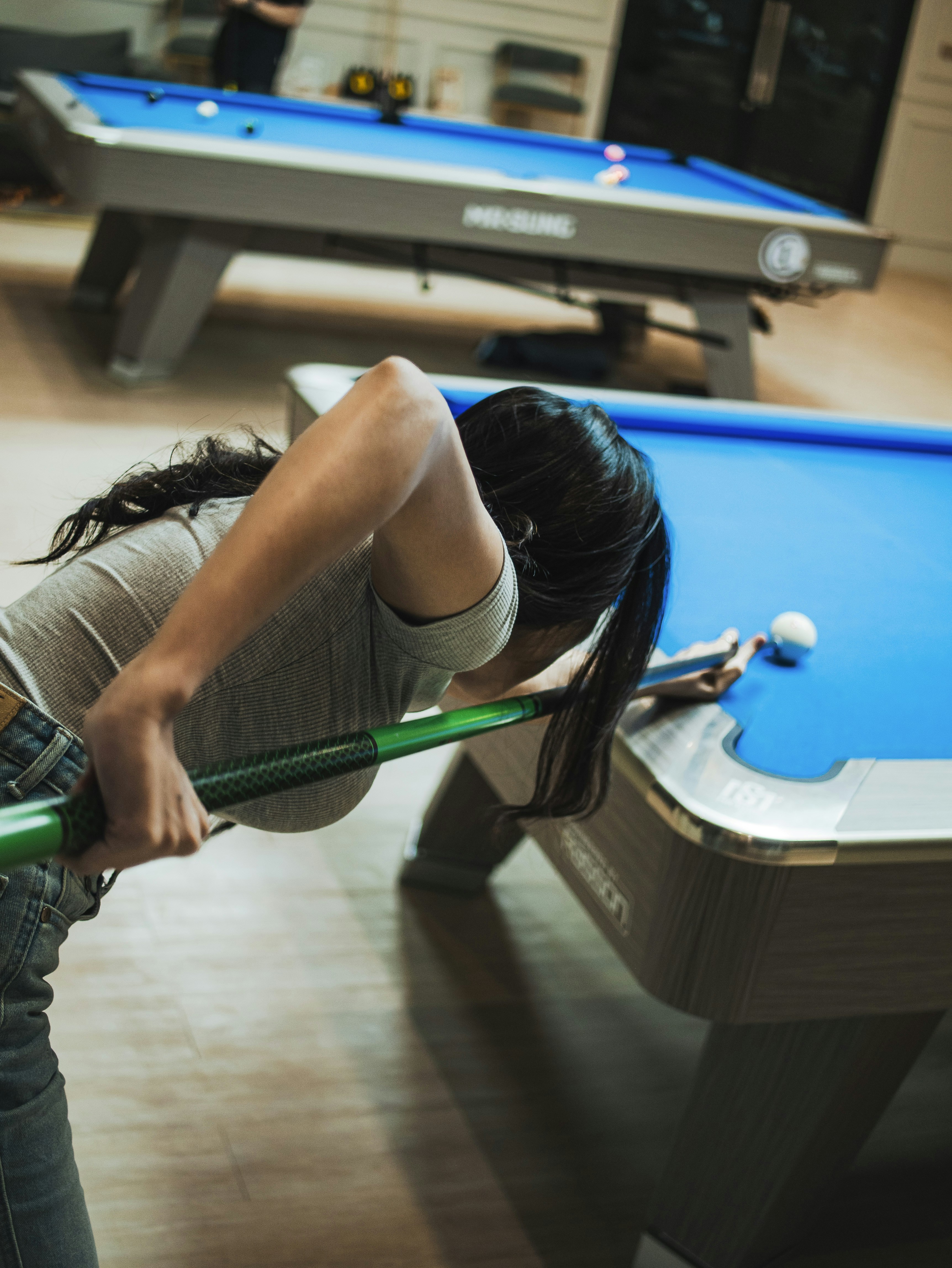 A woman is leaning over a pool table photo – Free Billiard Image on ...