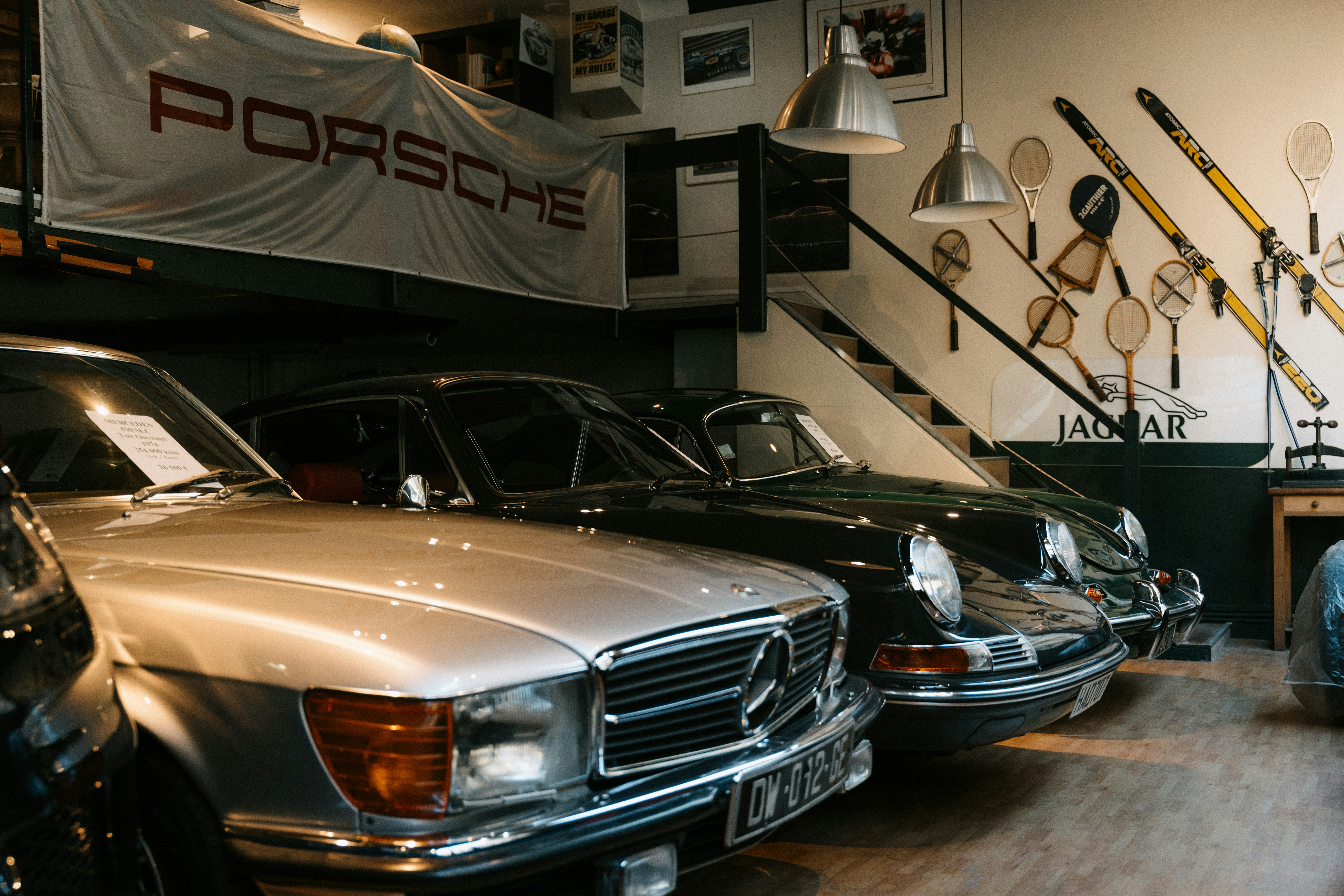 Classic Car Spotlight: A Row of Vintage Mercedes in a Retro Garage