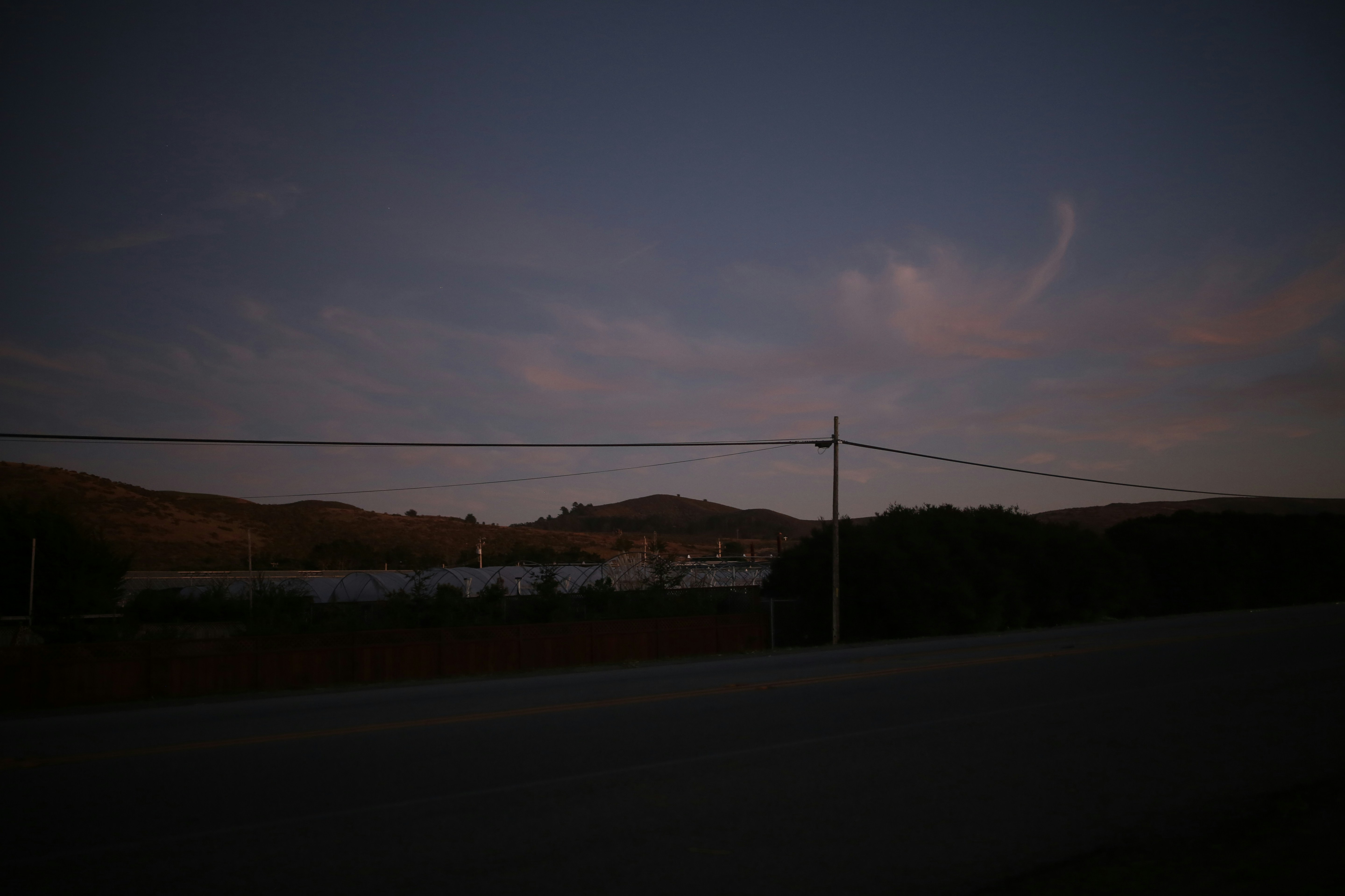 Twilight on the Ridge: A Quiet Road Between Distant Hills