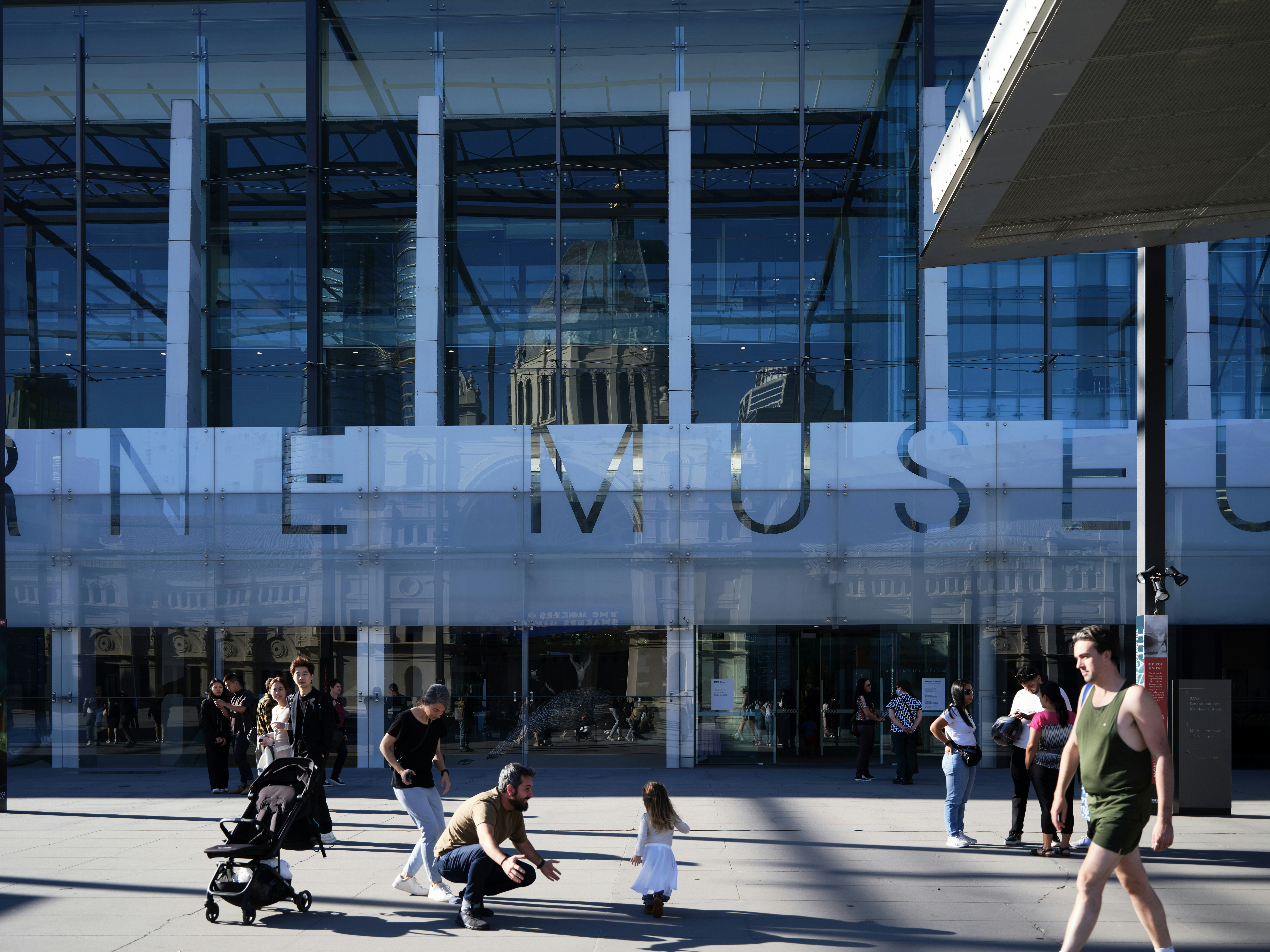Shadows and Strolls at a Glass-Faced Museum