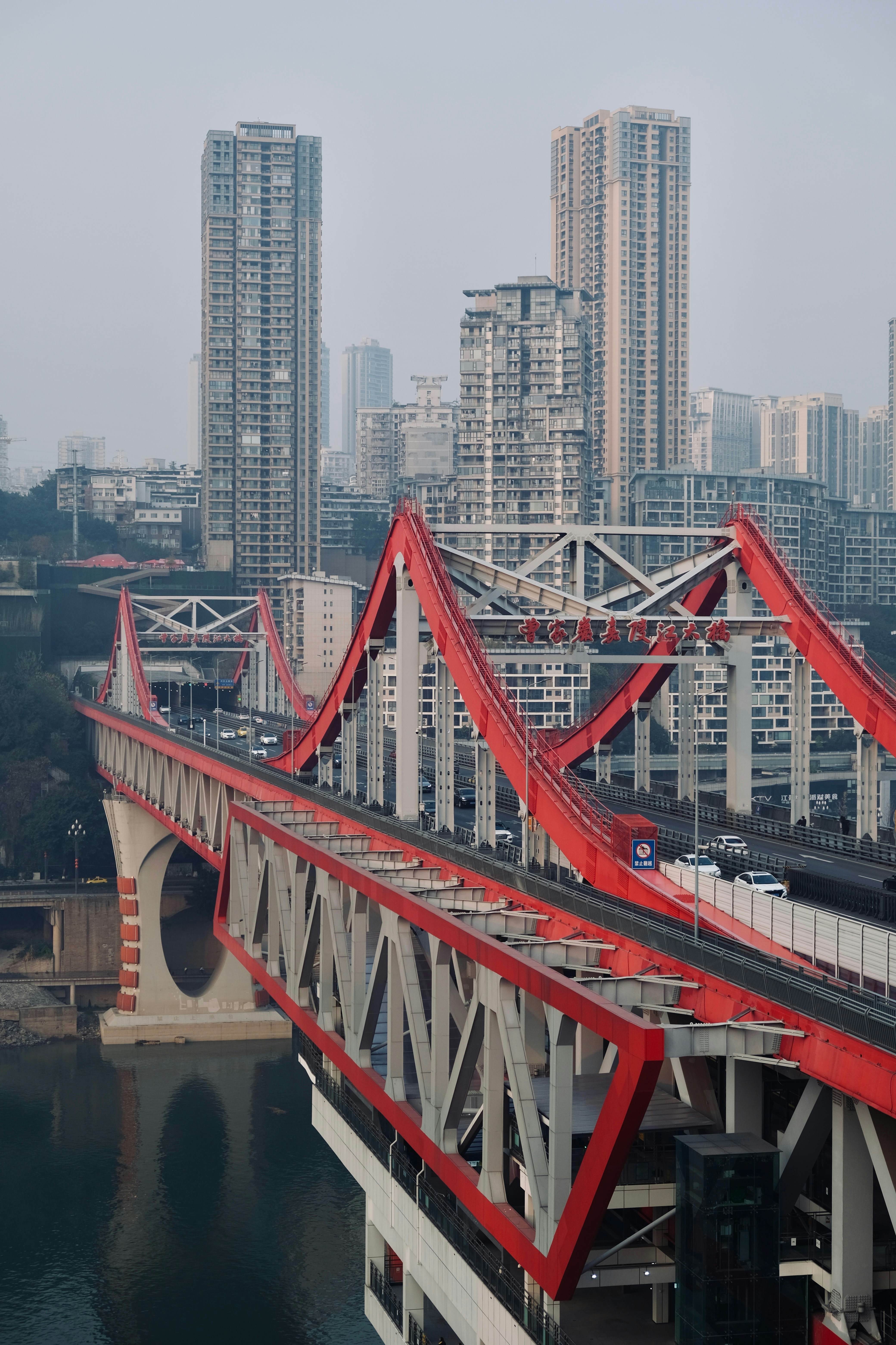 Crimson Arches Over a Misty City River