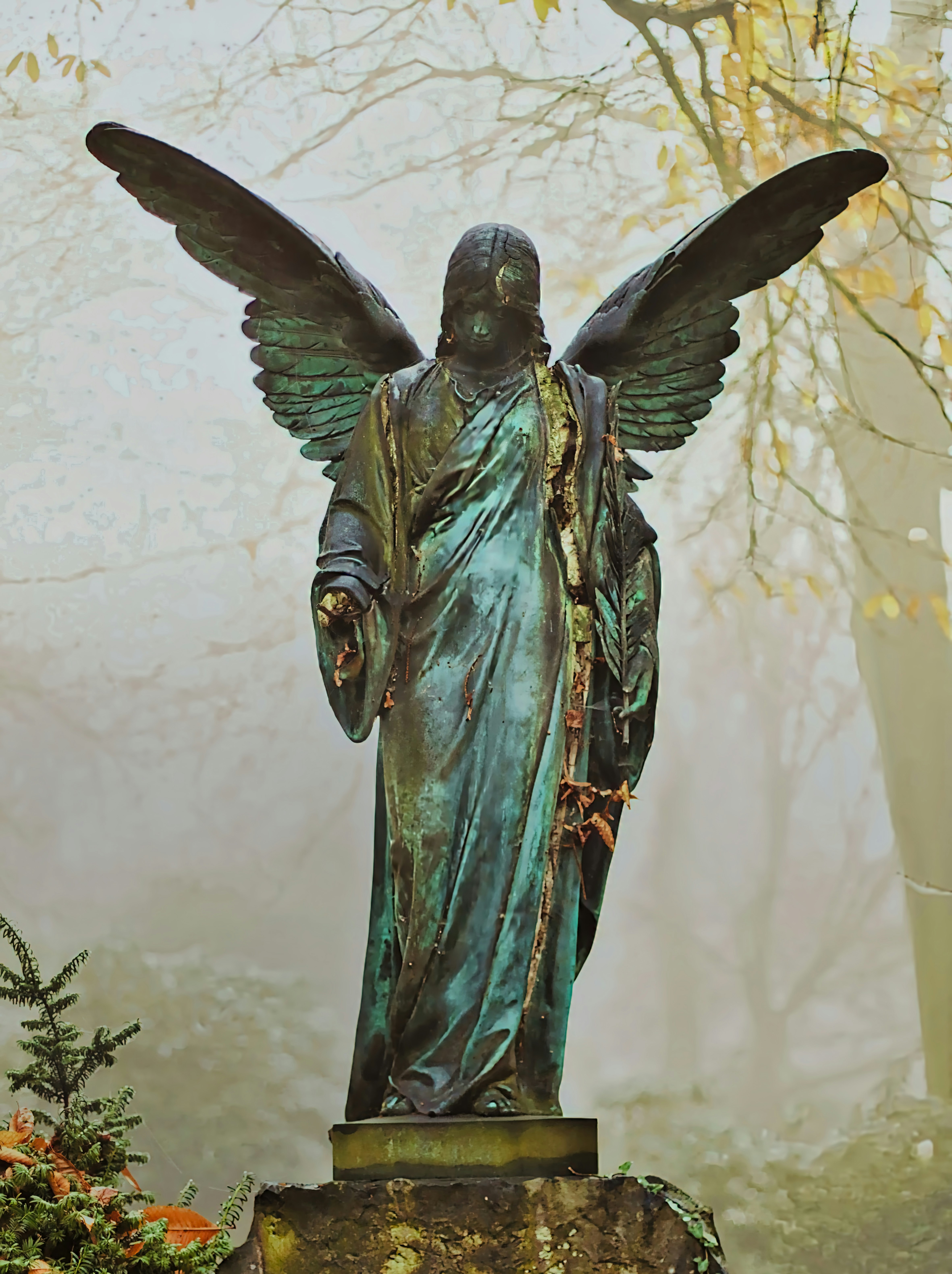 Mistbound Angel: A Bronze Sentinel in Autumn Fog