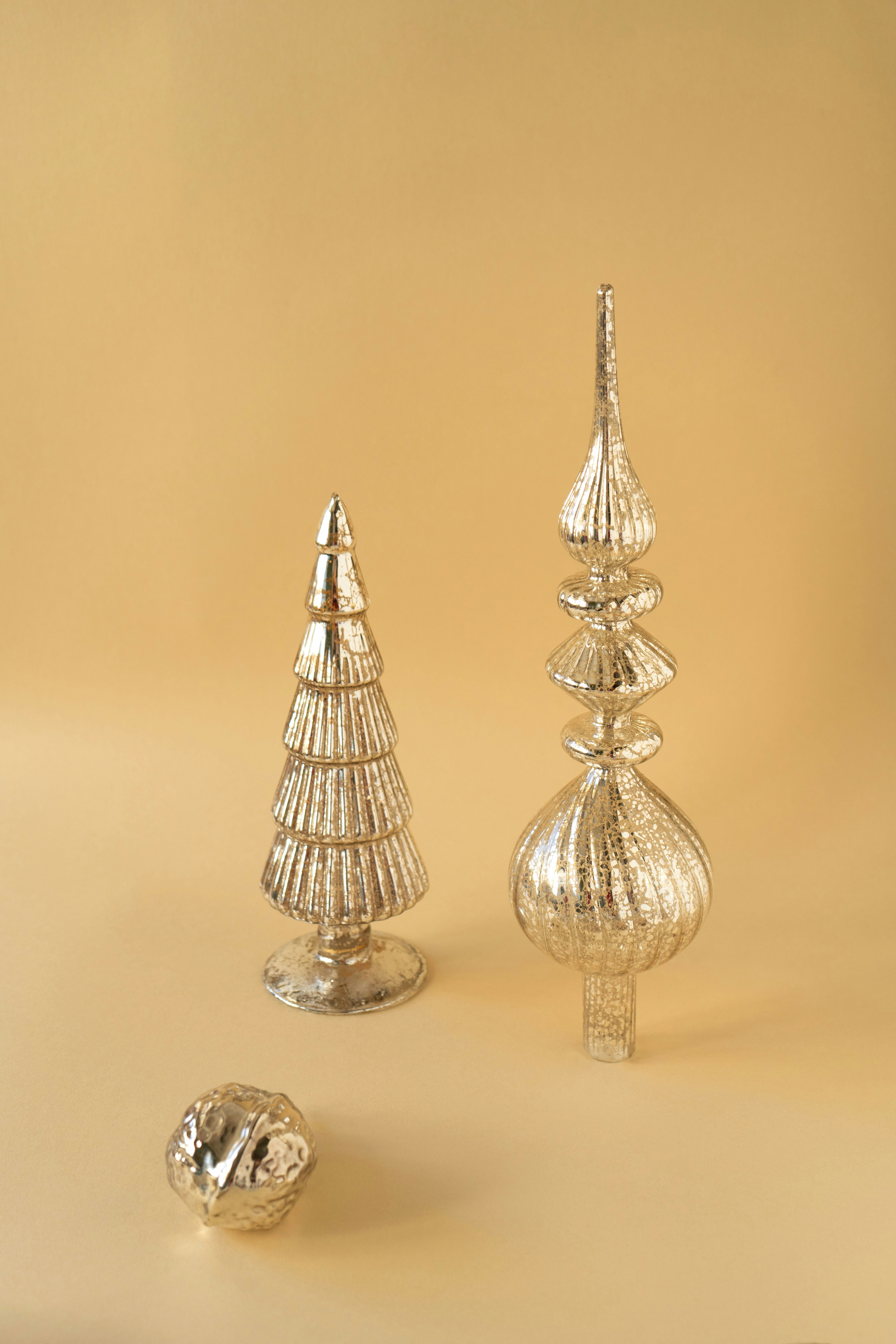 Twin Silver Finials on a Satin Gold Stage