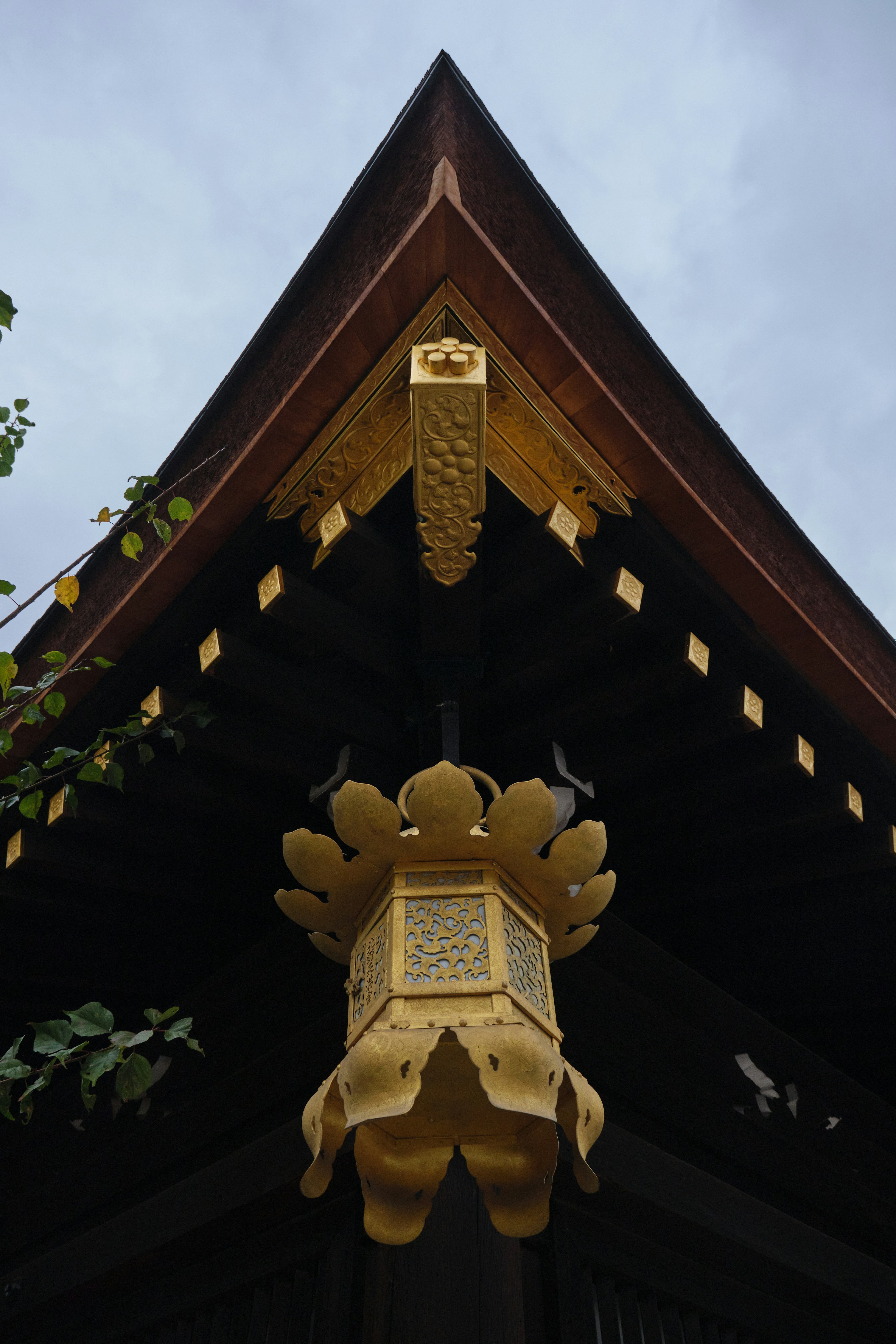 Gilded Lantern at the Eaves: Quiet Craft in Timber and Gold
