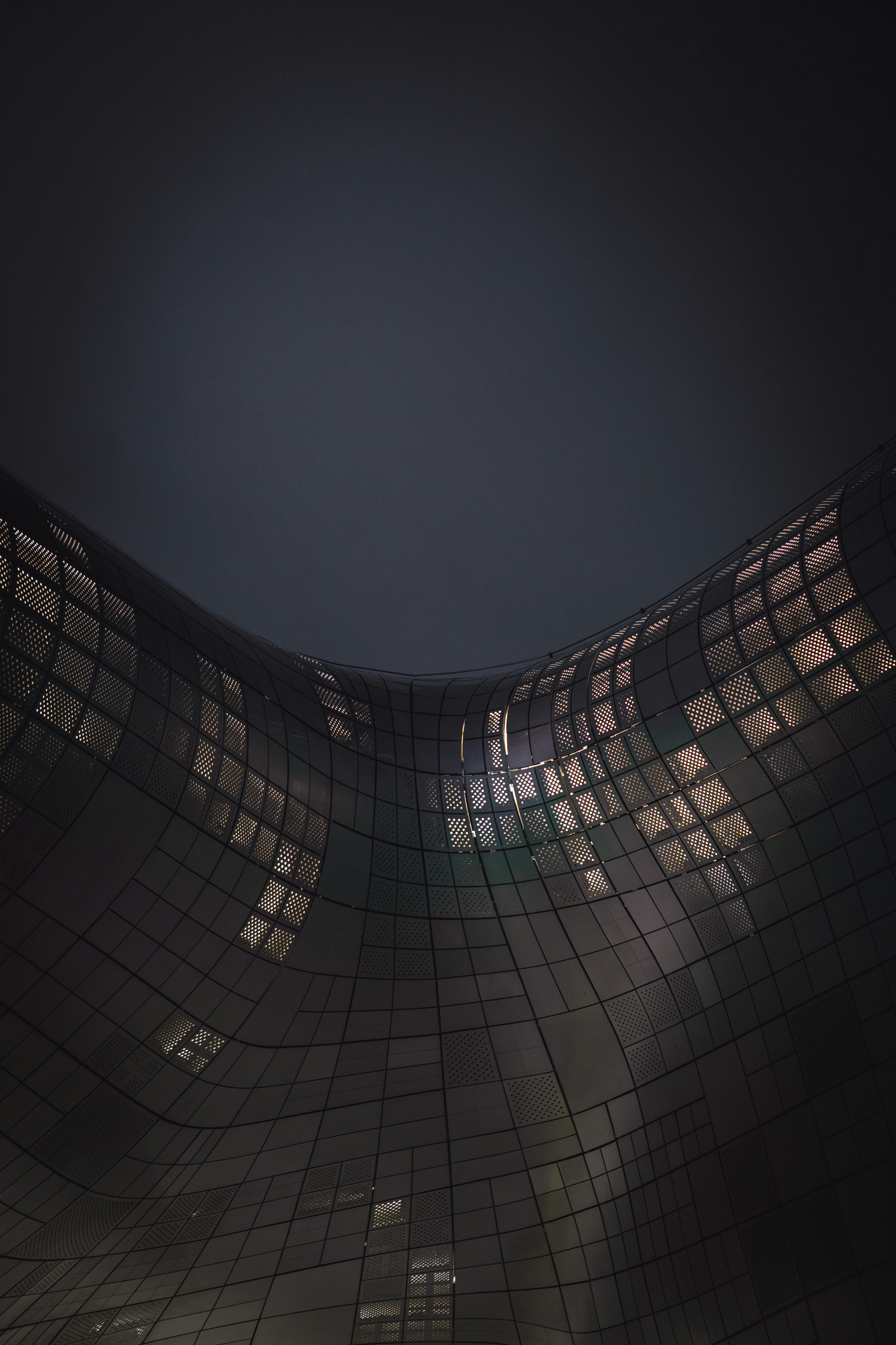 Nightfall Arch: A Curved Glass Facade Reaching Skyward