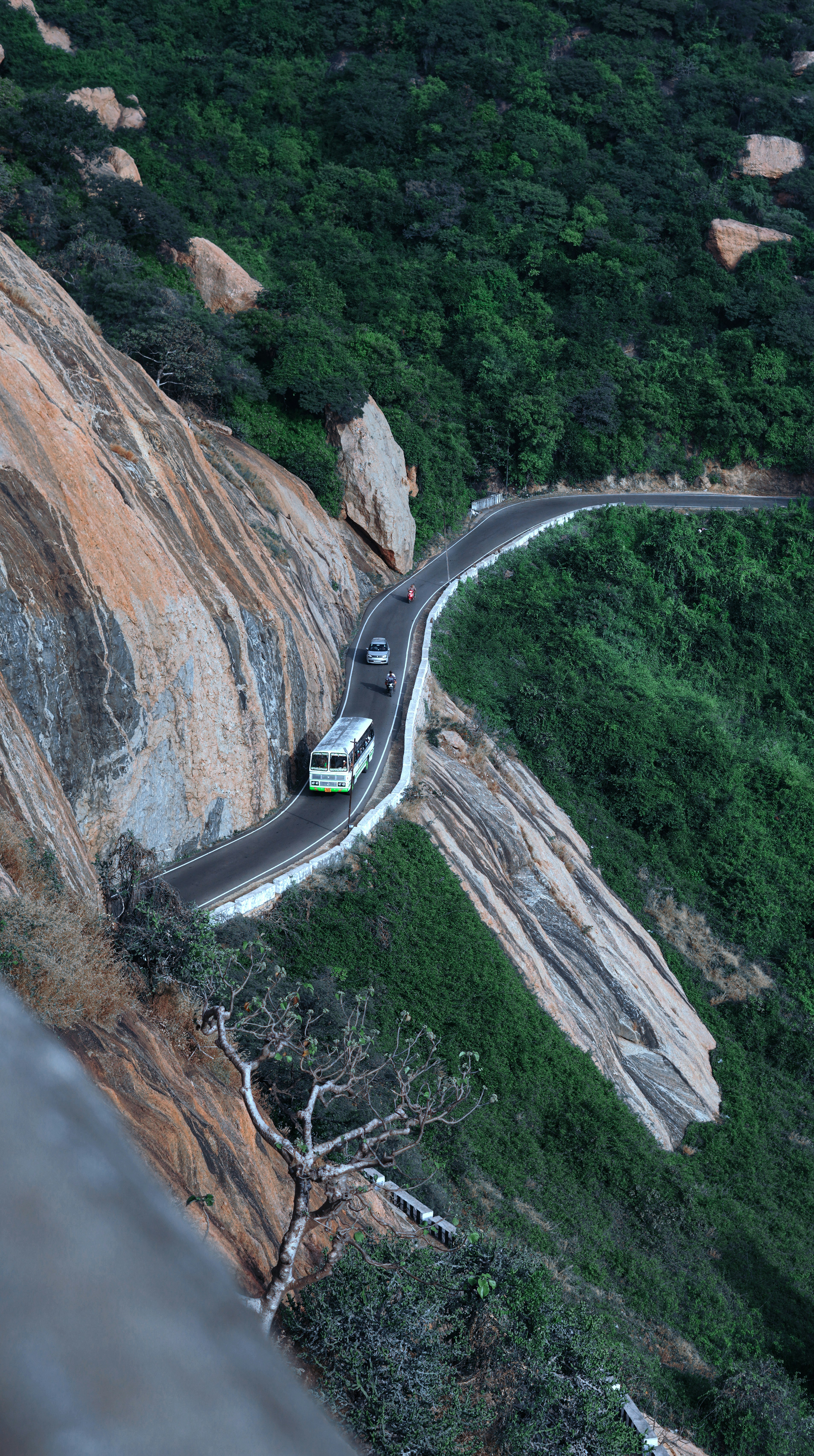 A car is driving down a steep mountain road photo – Free Travel Image on Unsplash