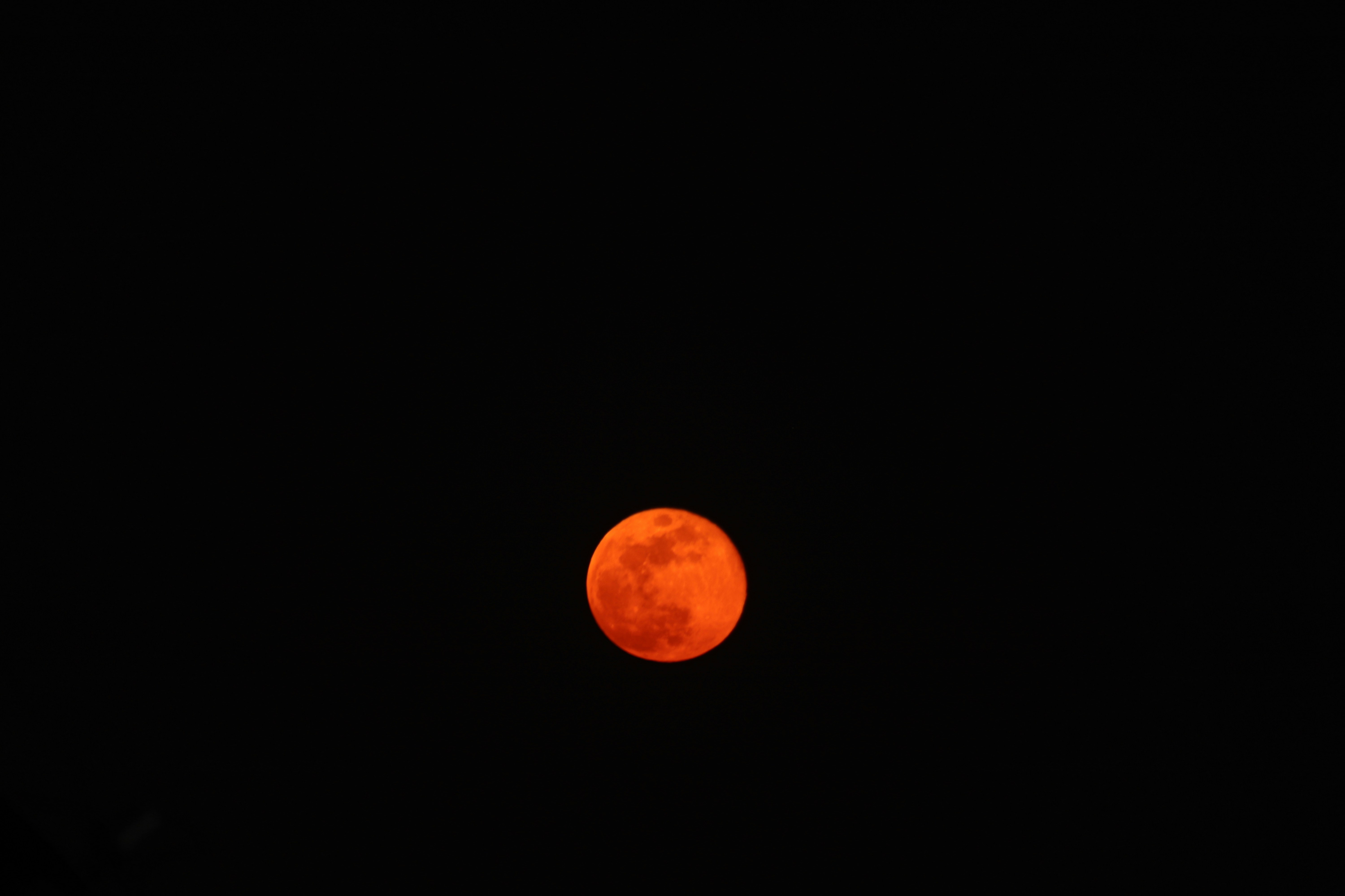 Lunar Ember in the Night Sky
