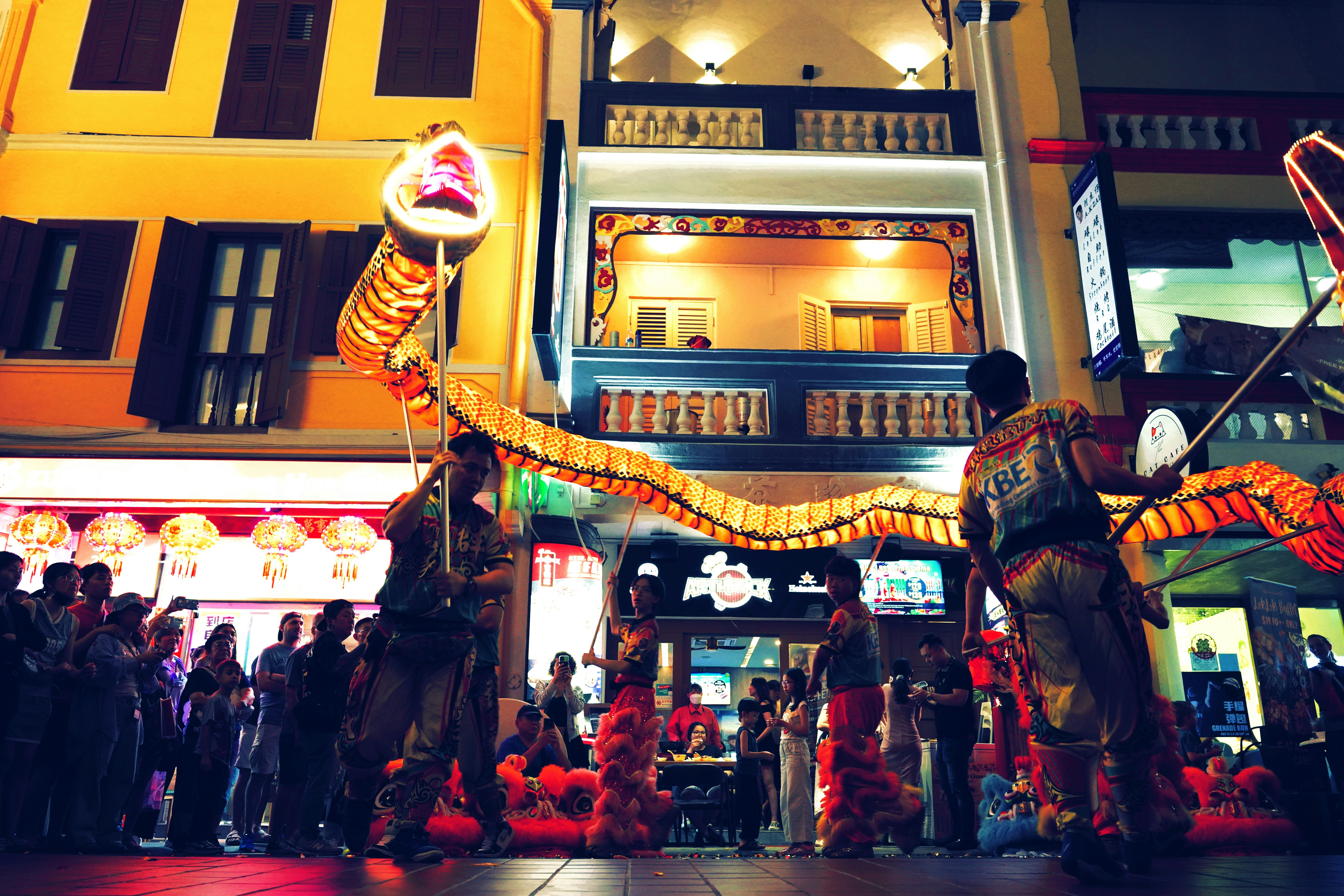 Dragon's Head Under Neon Lanterns: A Night Market Dragon Dance