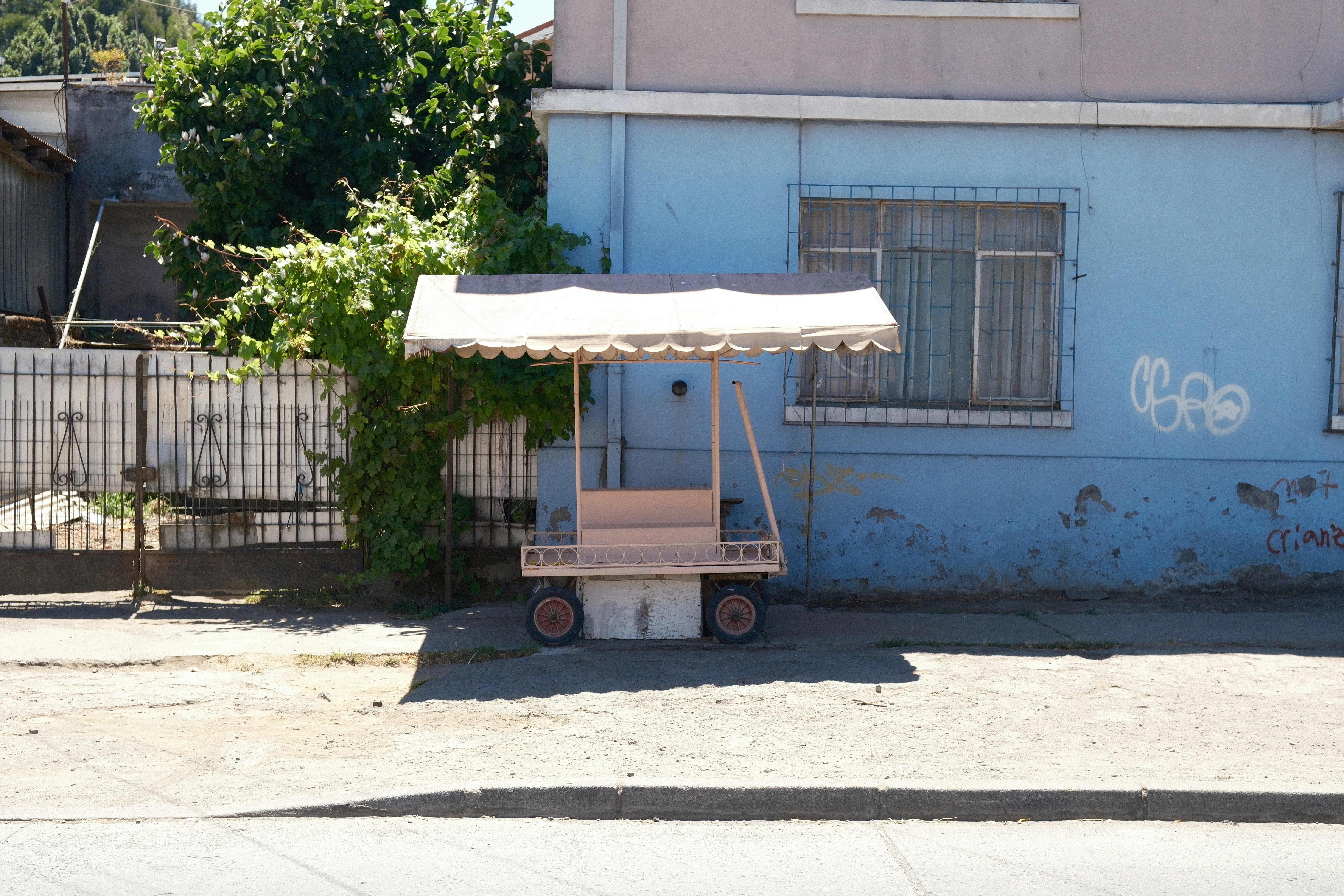 Serene Street Corner with Blue Facade