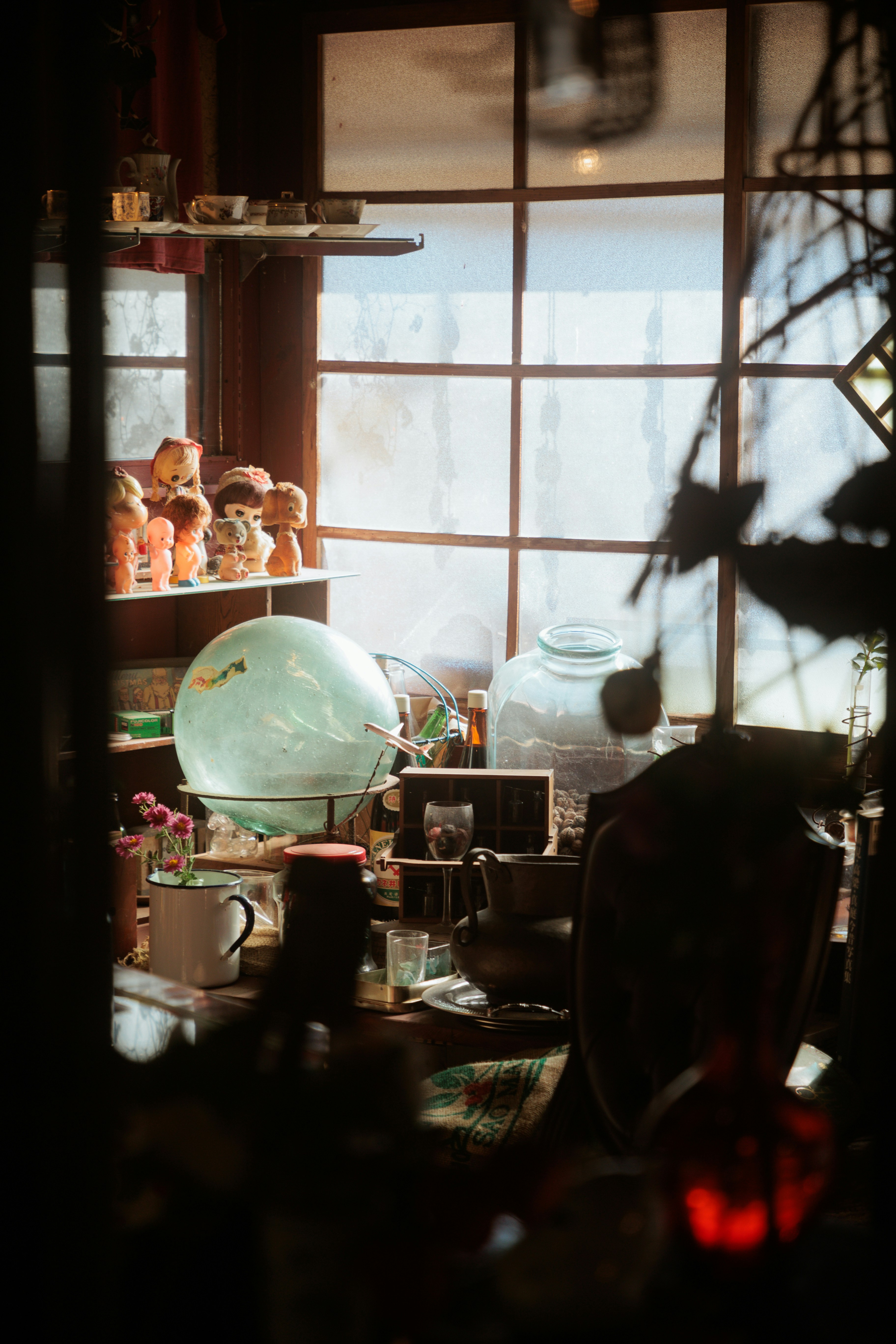 A room filled with lots of clutter next to a window photo – Free Cafe ...