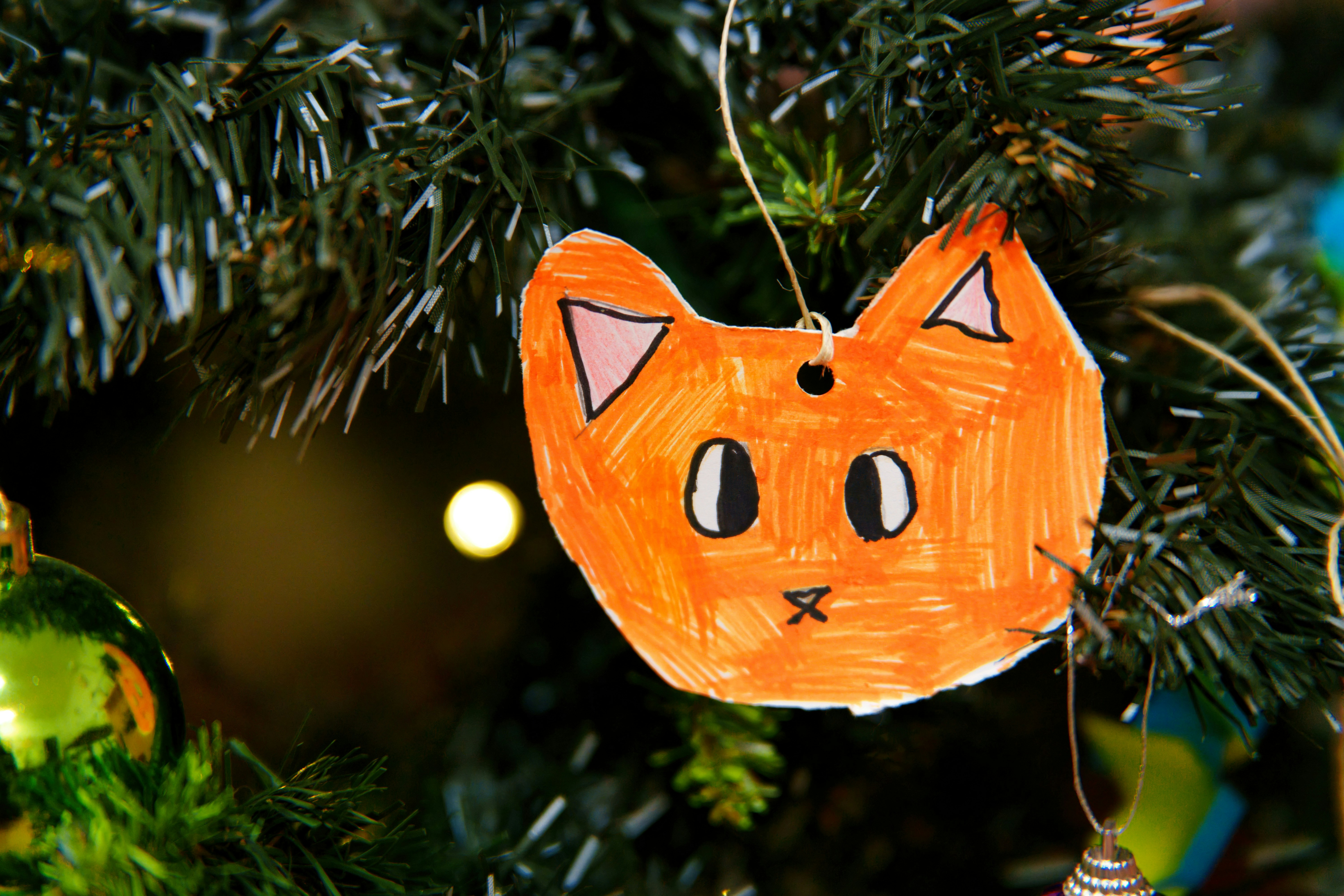 Handmade Orange Cat Ornament Adorns a Pine Christmas Tree