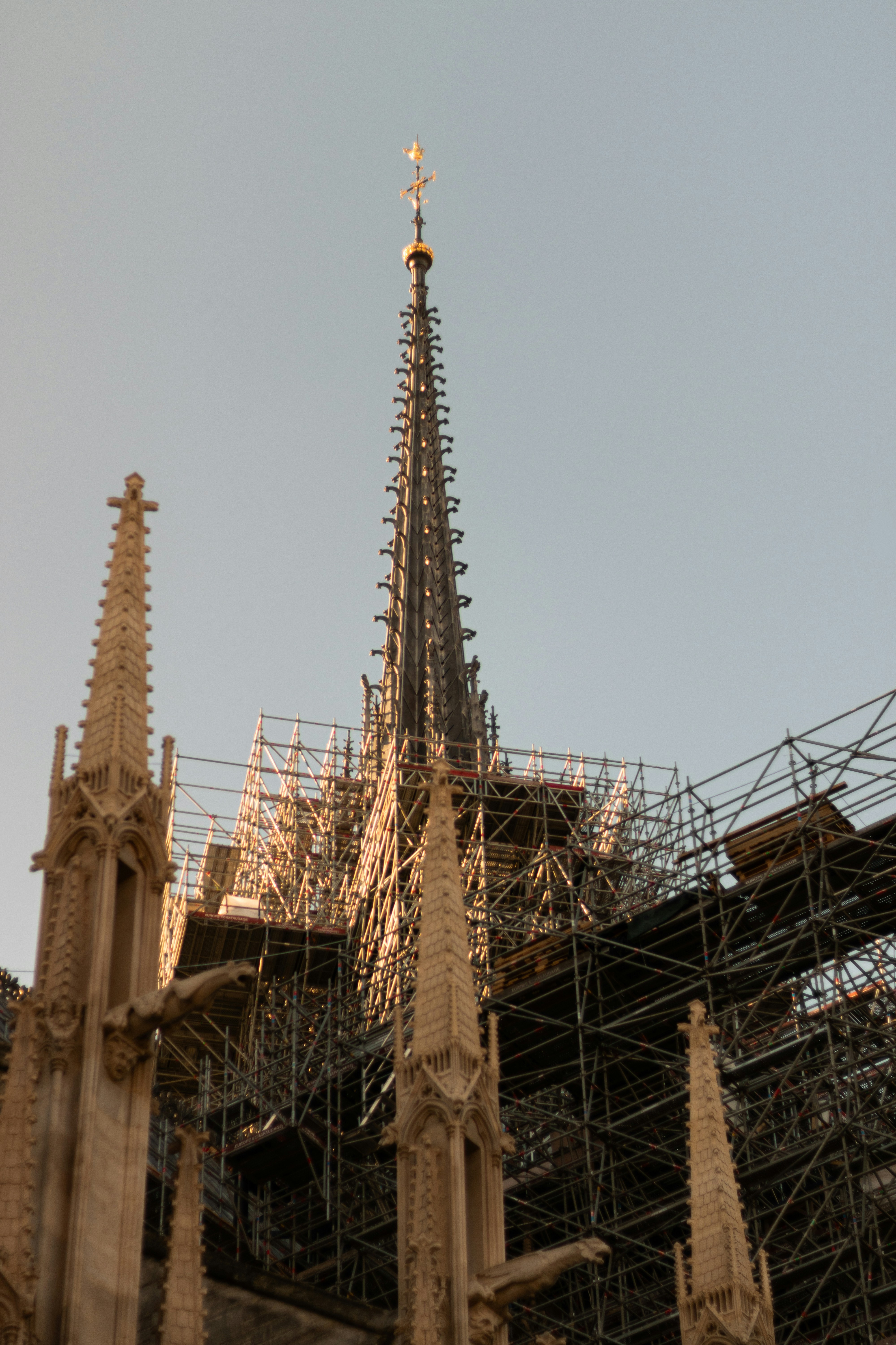 Spire in Scaffolding: Gothic Peak Under Construction