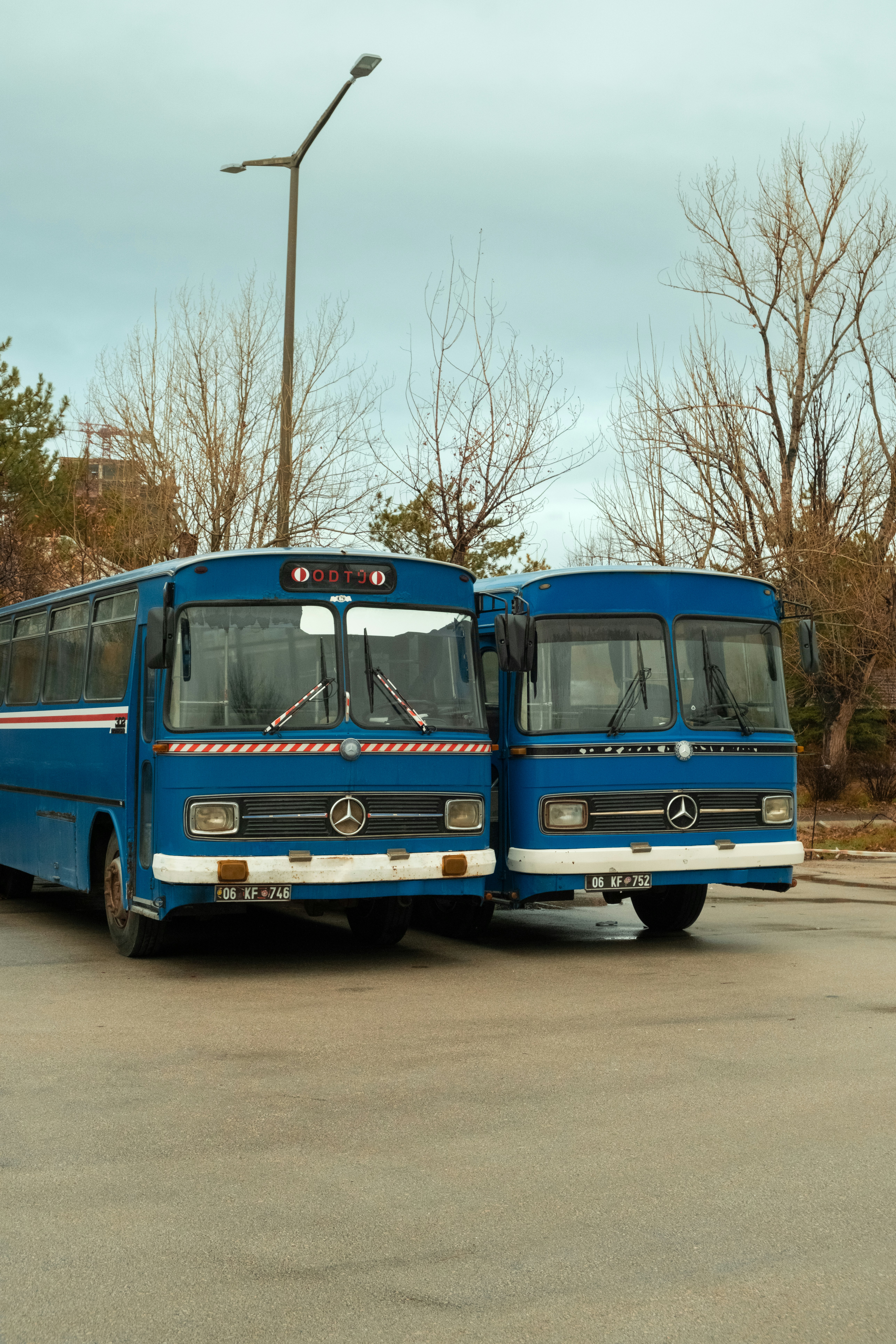 A couple of blue buses parked next to each other photo – Free Vintage ...