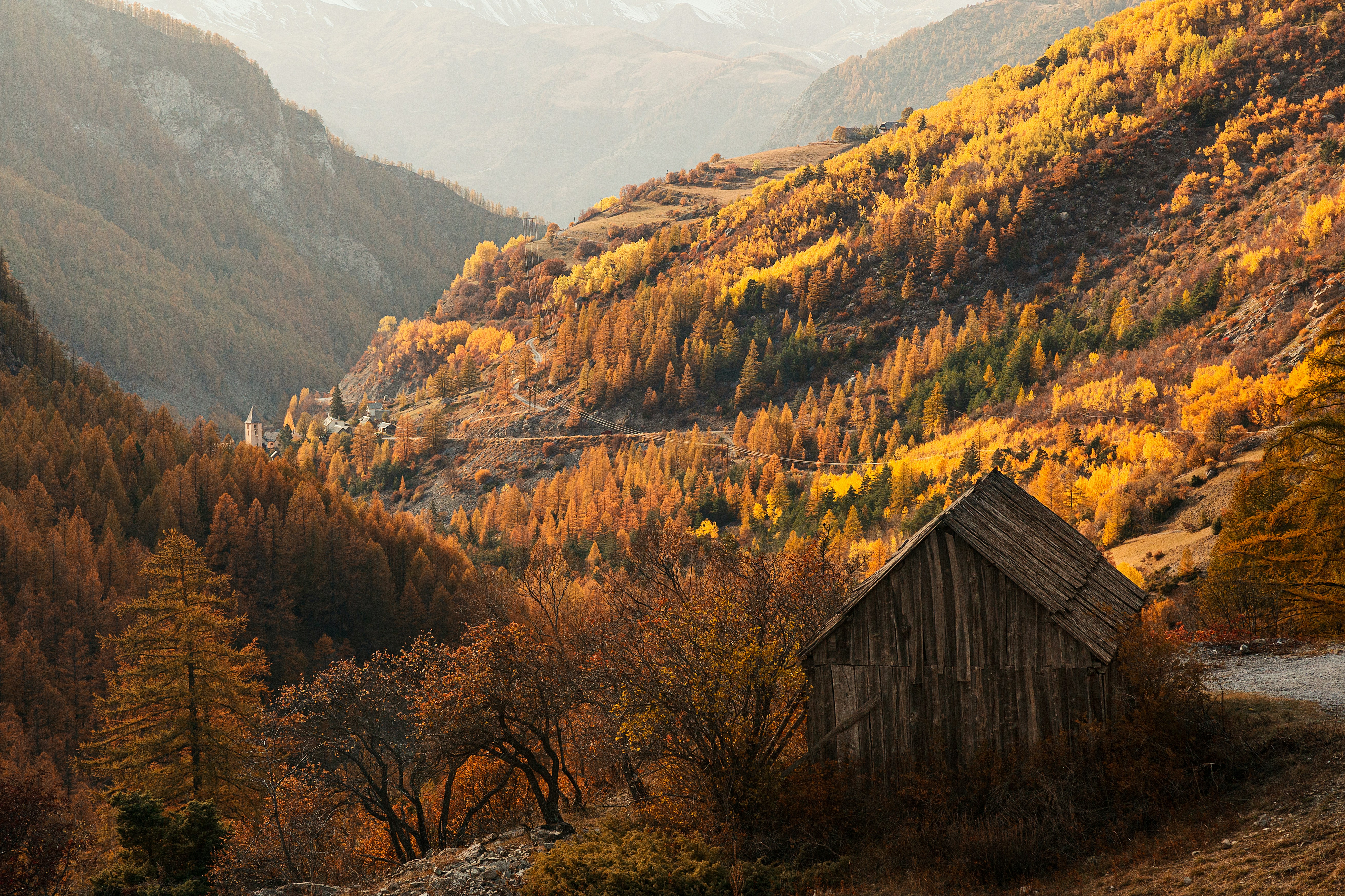 Weathered Barn Amid a Golden Autumn Valley