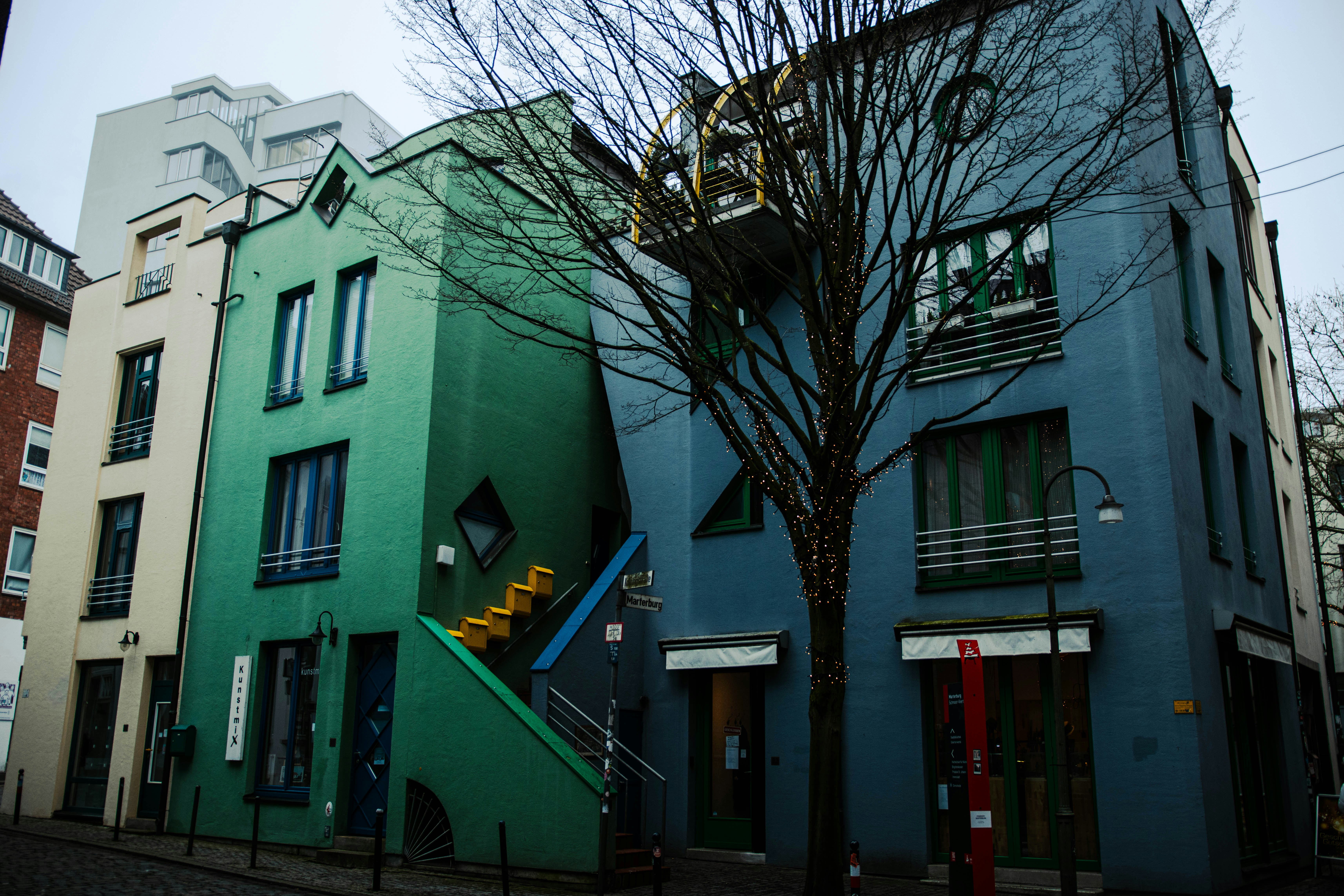 A row of multi - colored buildings on a city street photo – Free Street ...