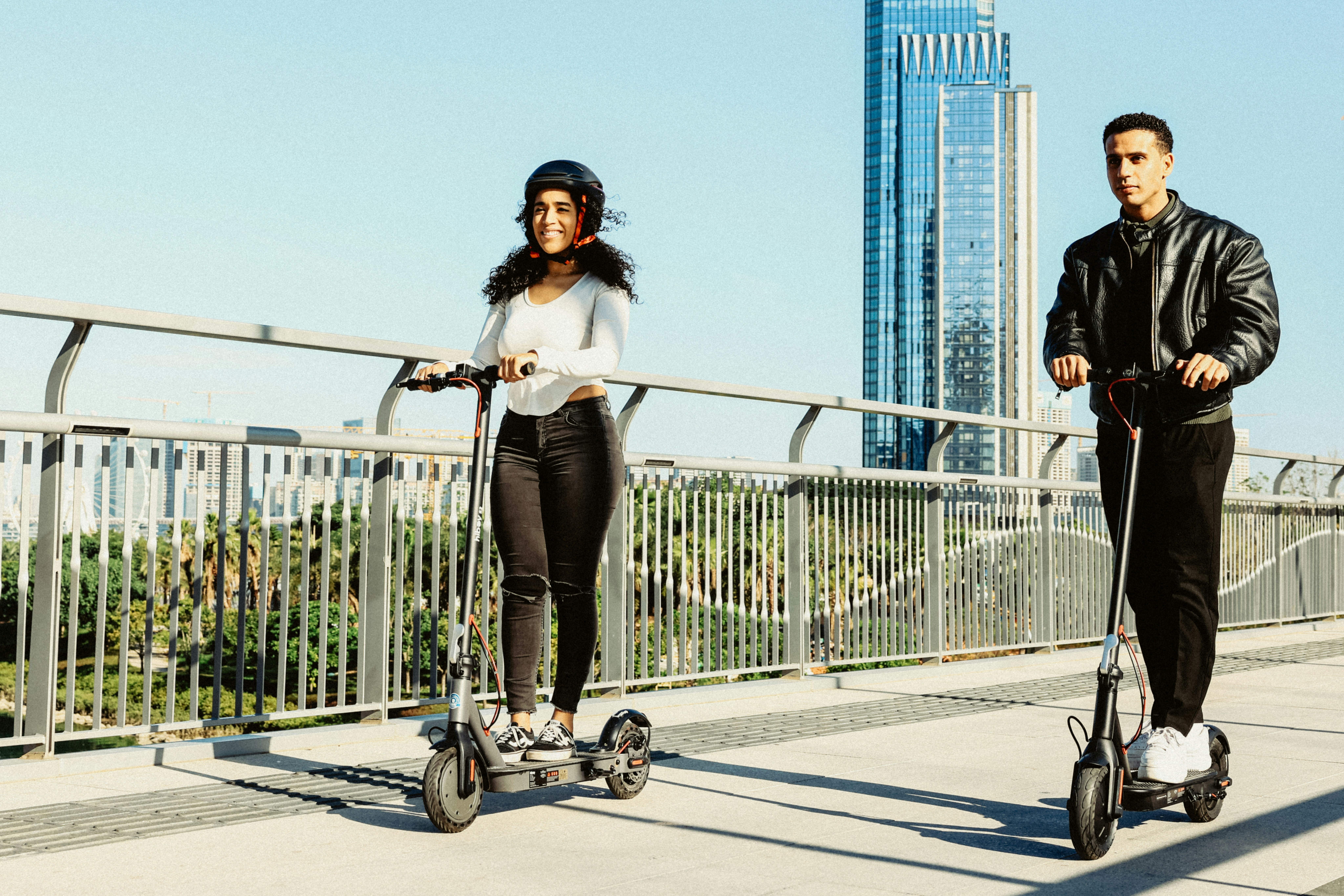 Rider Statues on a Glassy Skyline Crossing