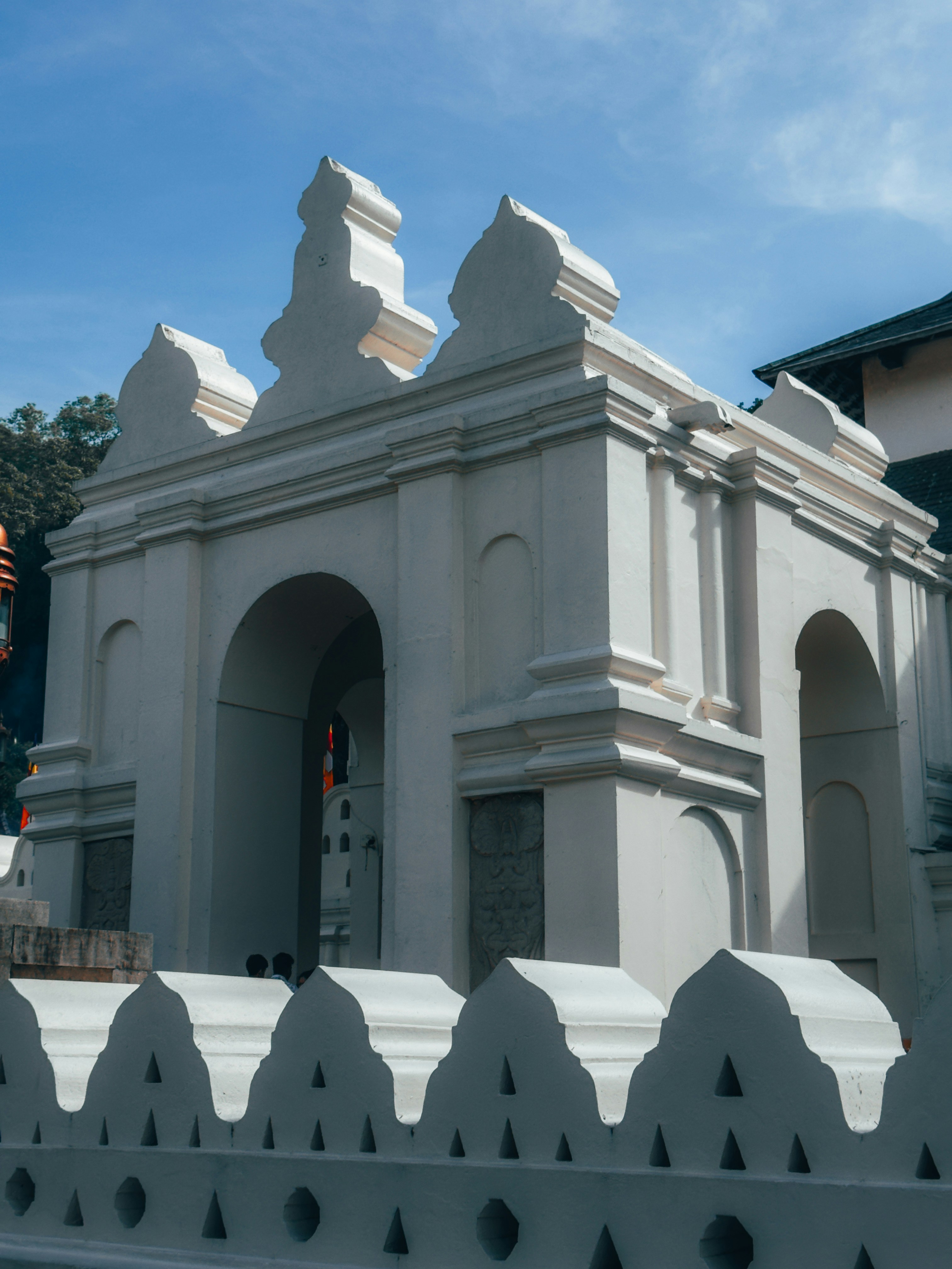 Sunlit Neoclassical Archway: Quiet Geometry in White