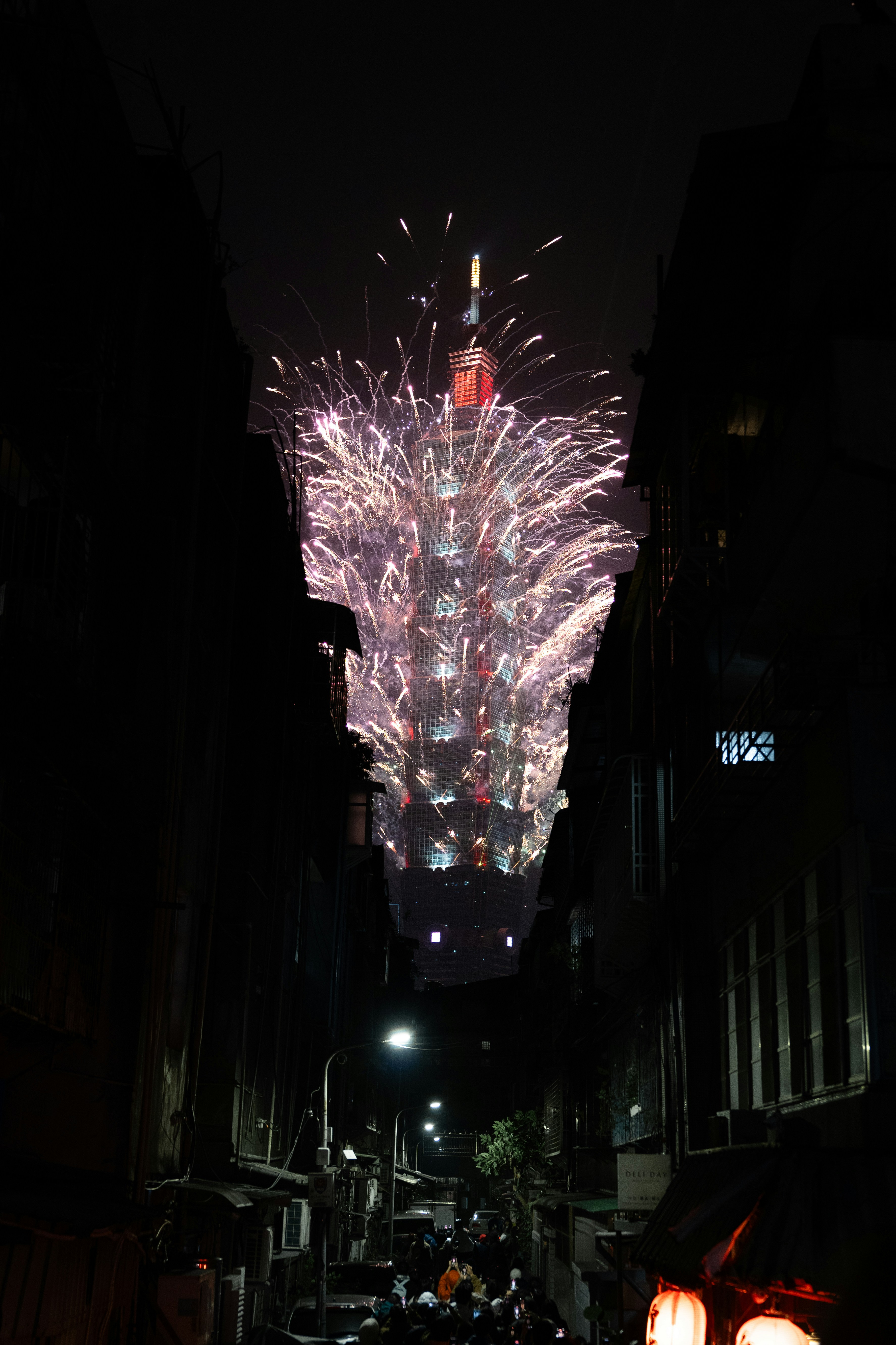 Skyfire Over Taipei: Fireworks Bloom Above a Narrow Street