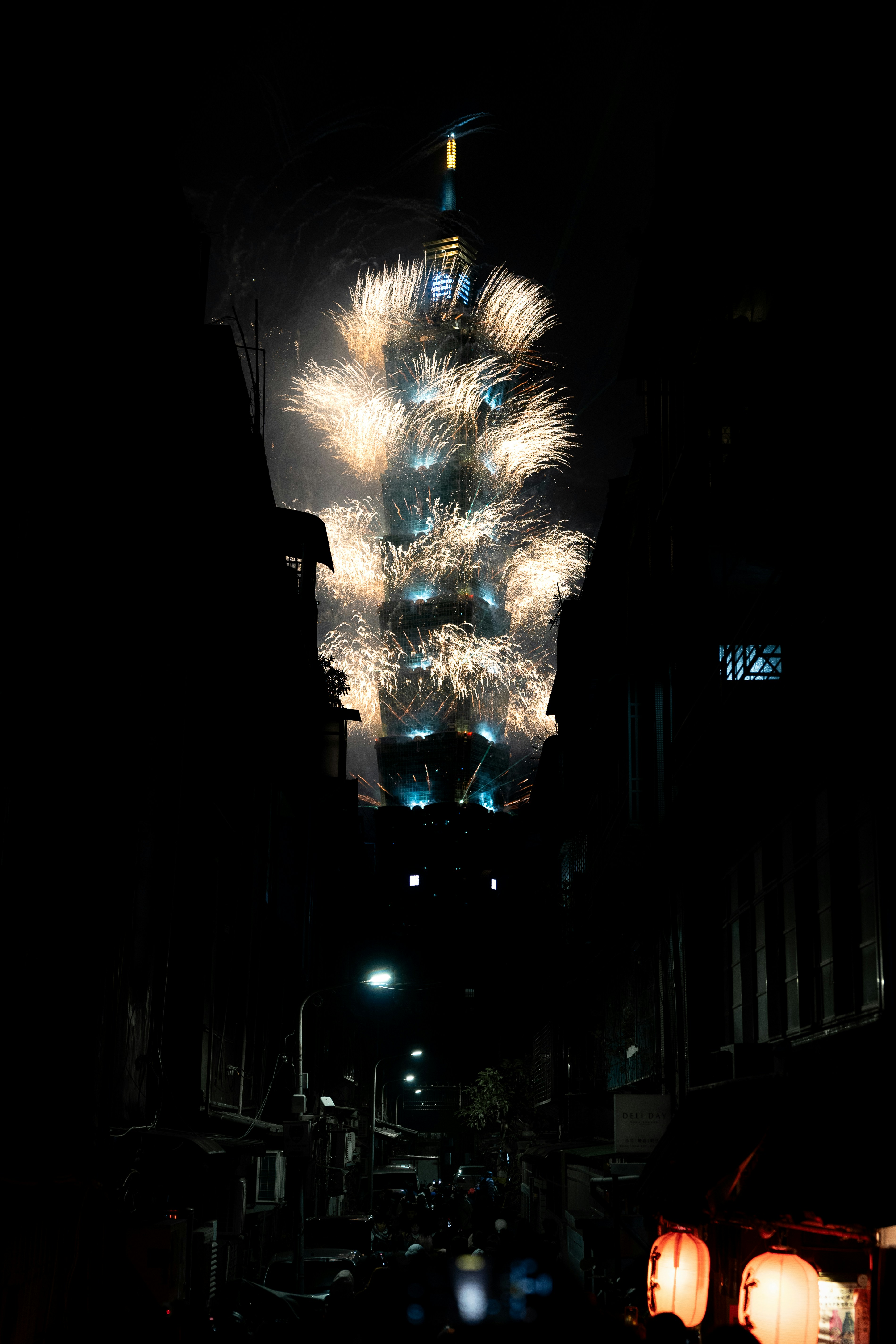 A fireworks display is lit up in the night sky photo – Free Lighting ...