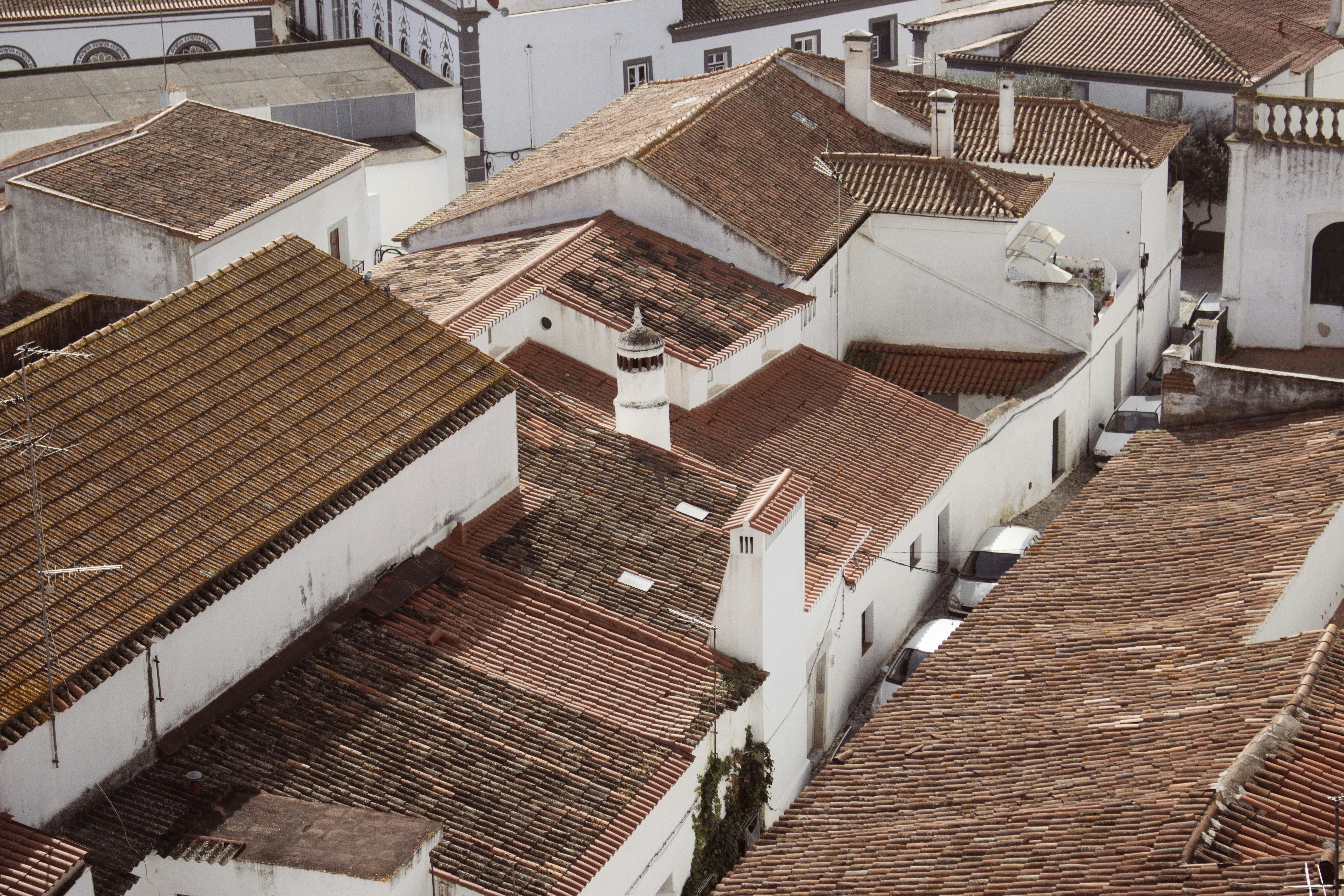 Rooftop Mosaic: White Walls and Terracotta Tiles from Above