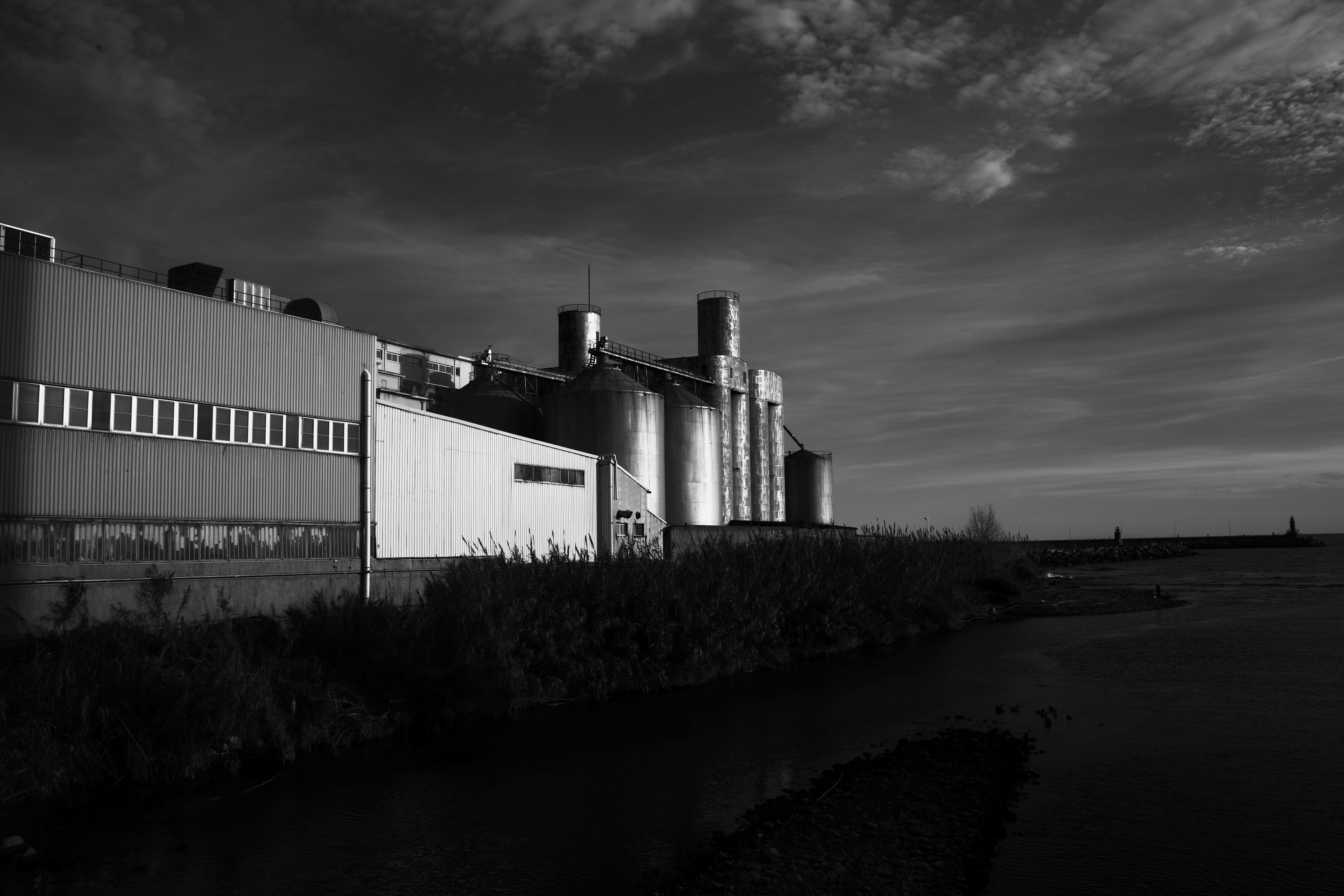 A black and white photo of a factory photo – Free Imperia Image on Unsplash