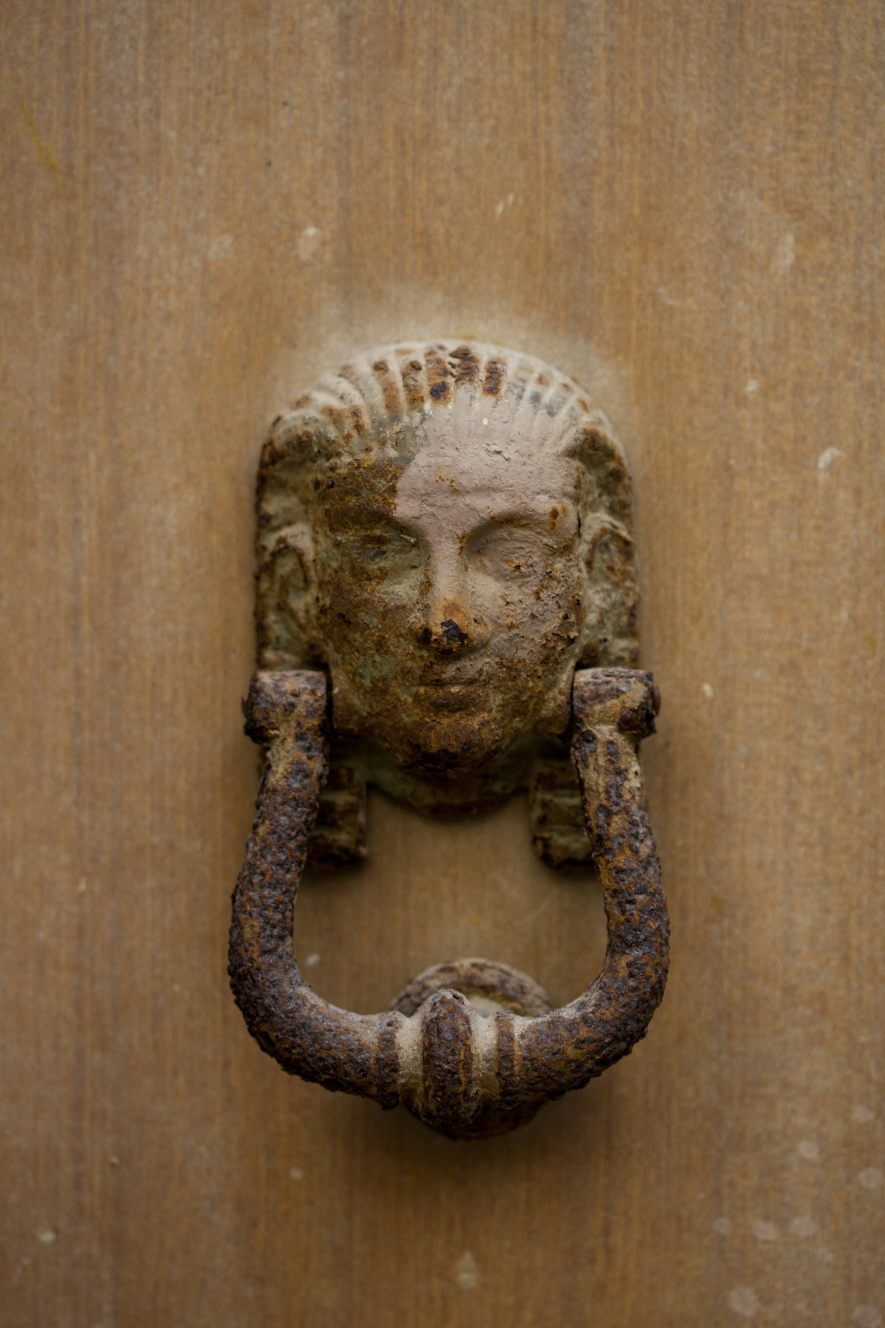 Rust on a Rustic Door Knocker: A Close-Up of Time-Worn Detail