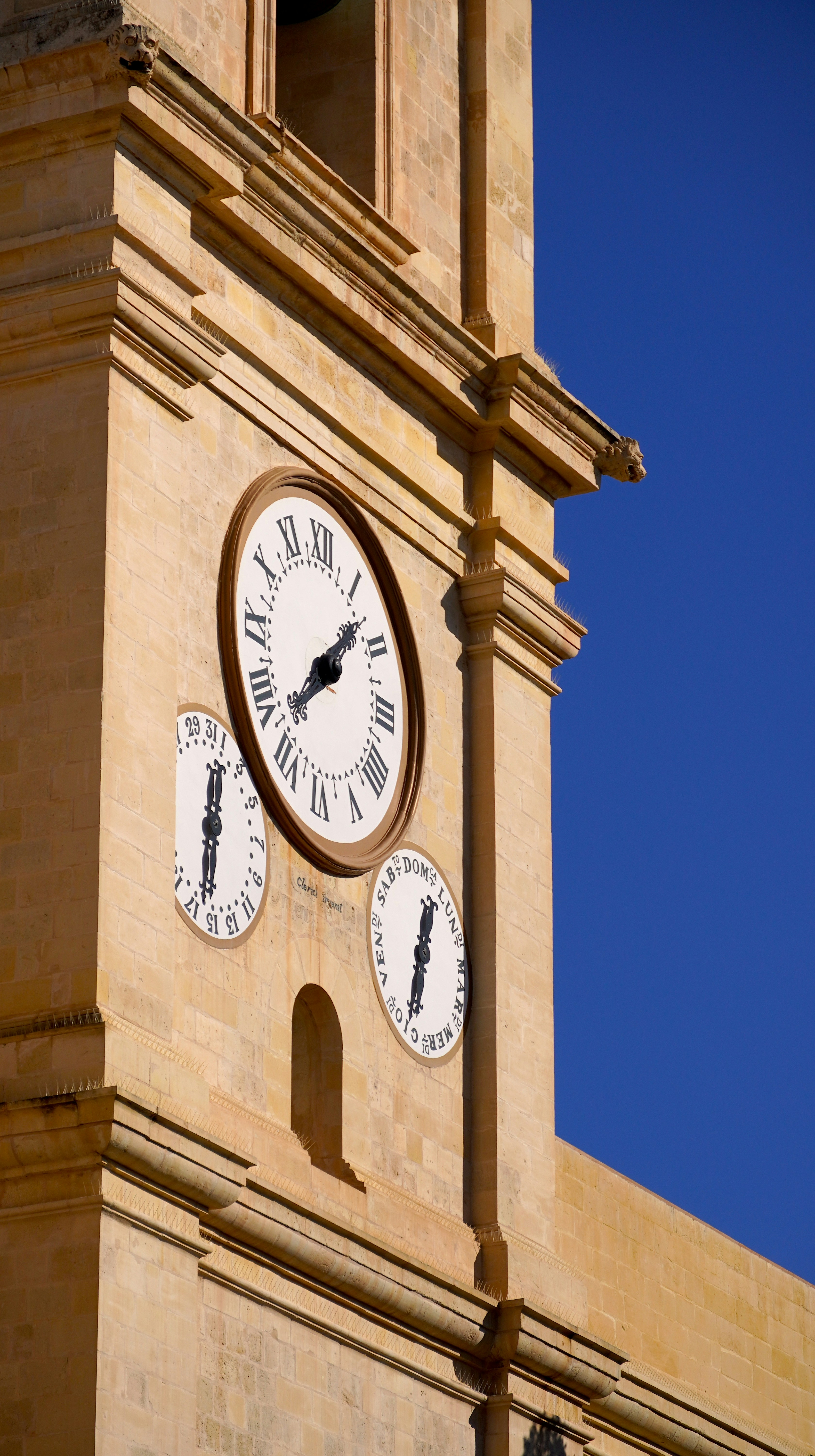 A clock tower with two clocks on each of it's sides photo – Free ...
