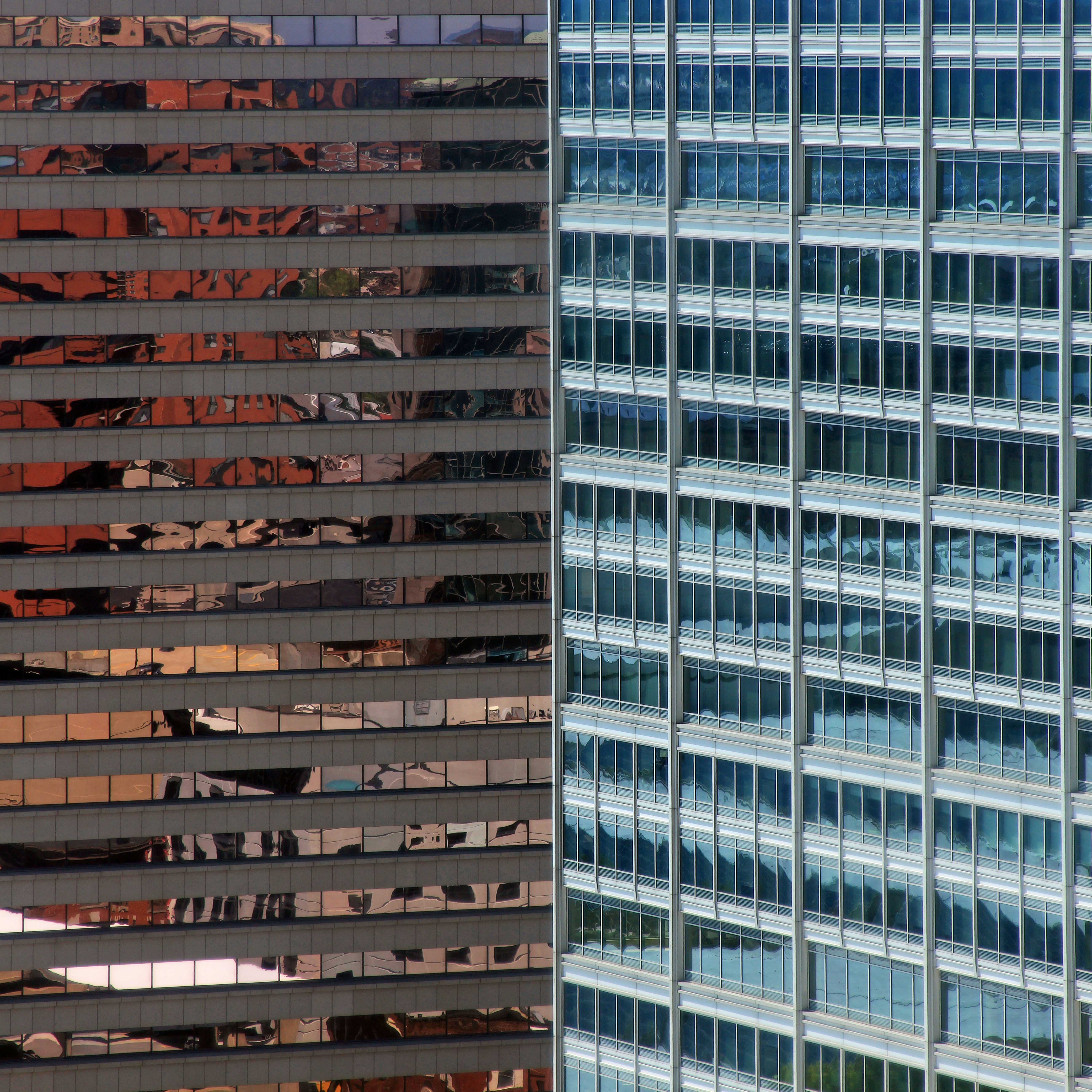 A tall building next to a very tall building photo – Free City Image on ...