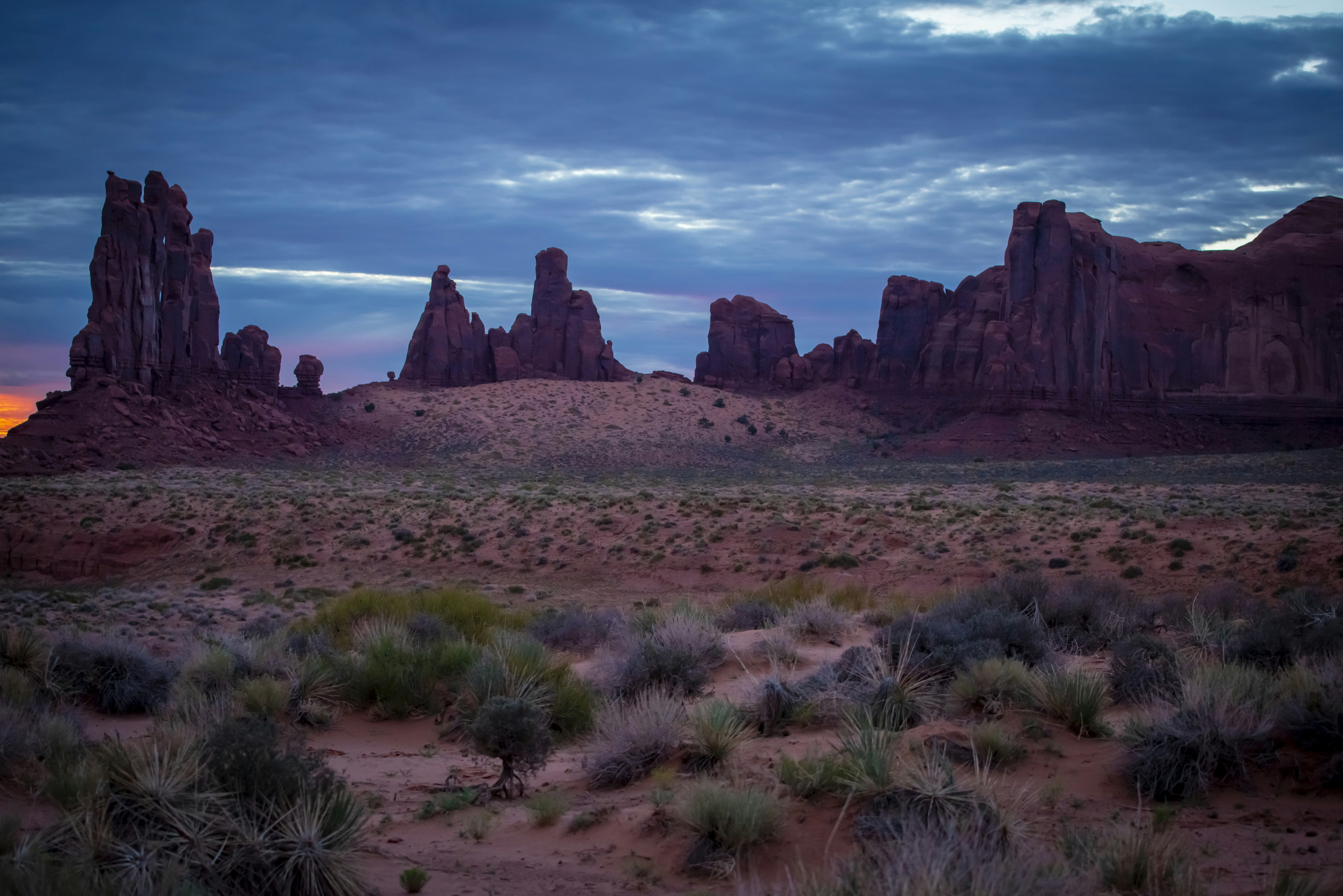 A desert landscape with rocks in the background photo – Free Mountains ...