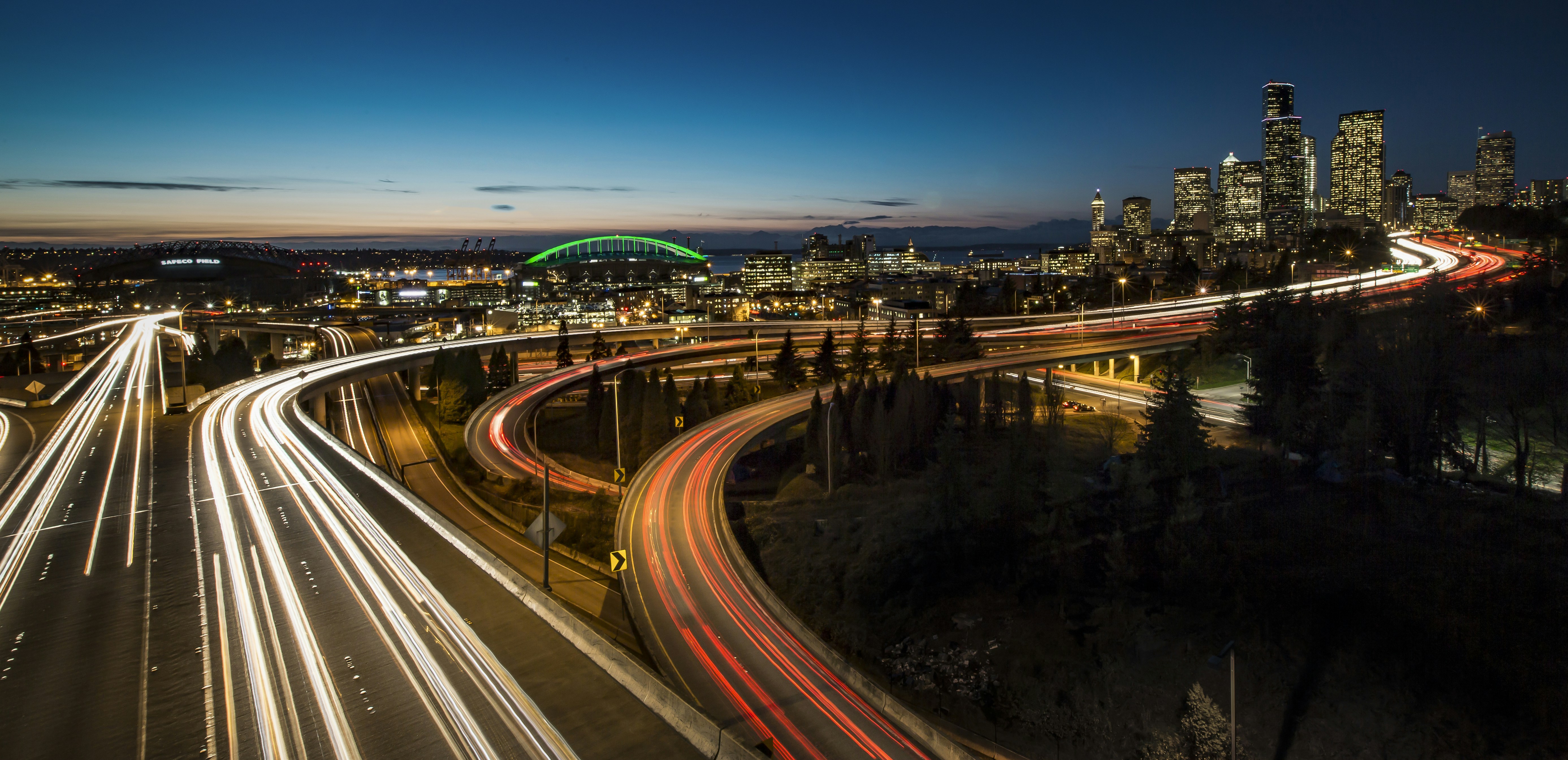 A view of a city at night time photo – Free Road Image on Unsplash