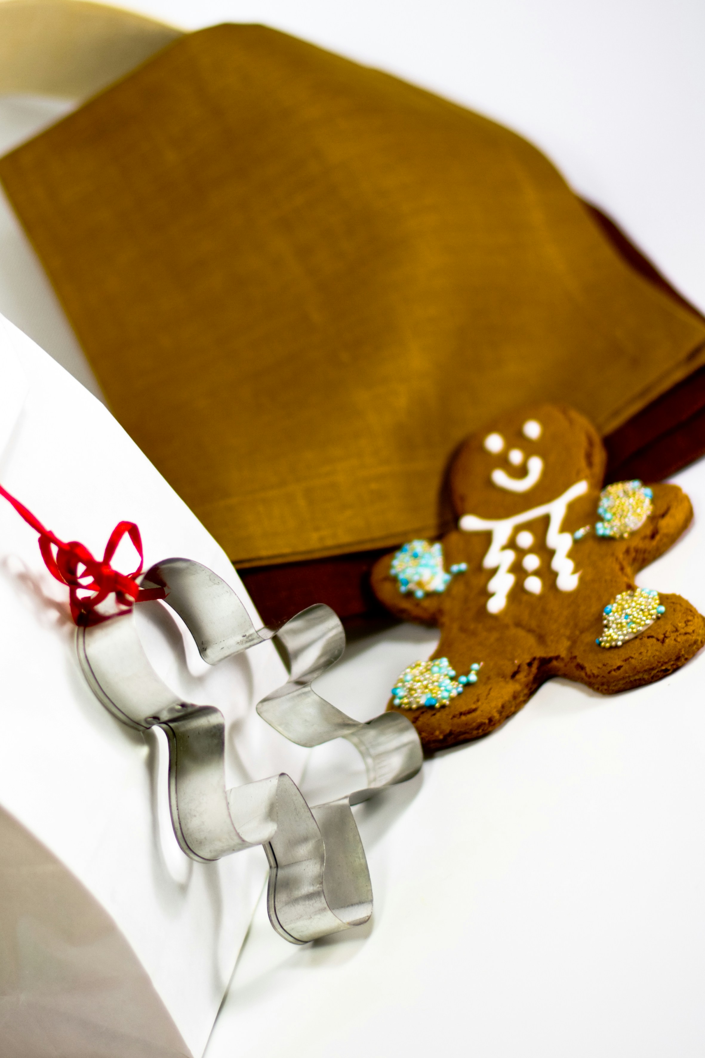 Gingerbread Smile Amid Silver Ribbons and Gift Wrap