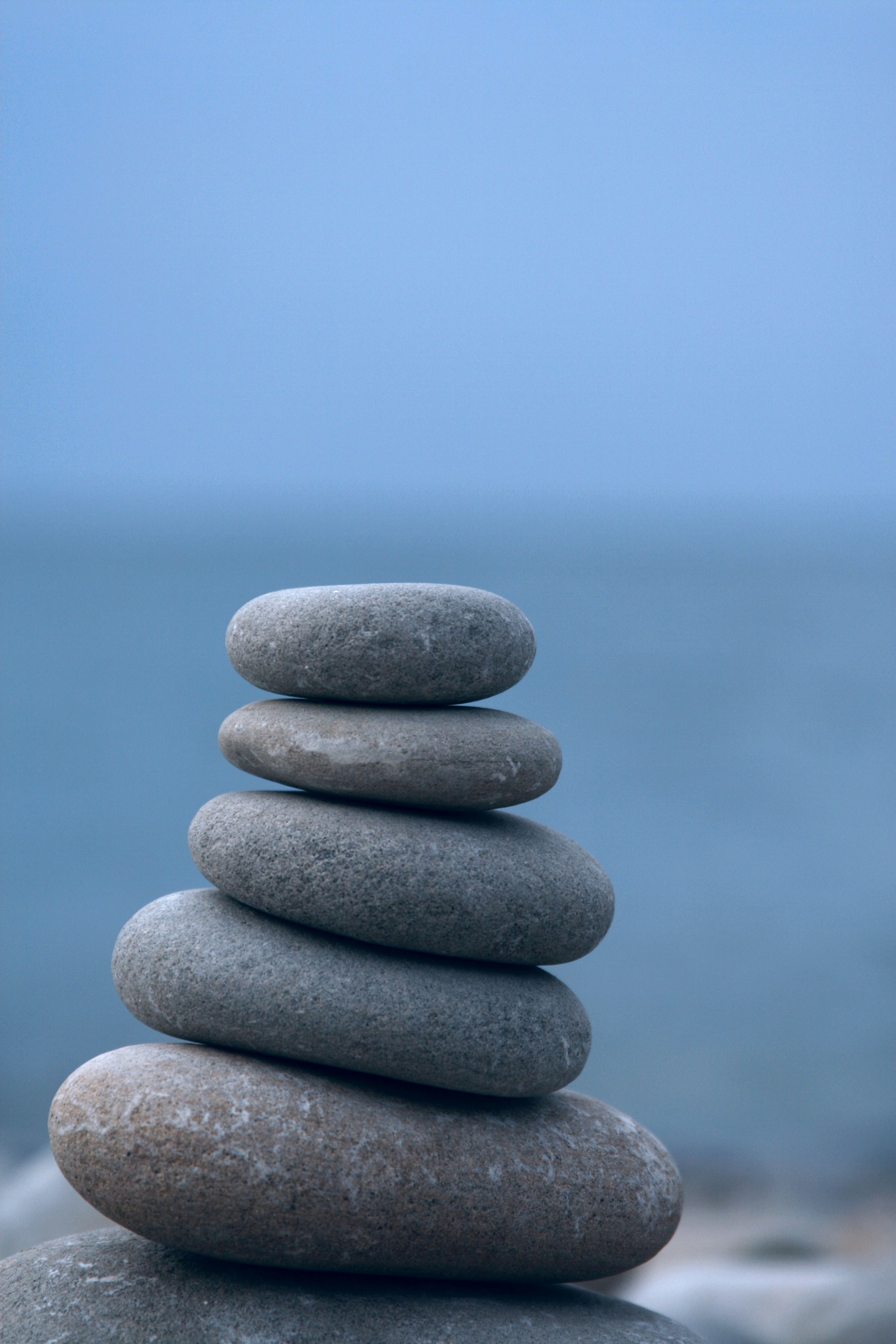 A stack of rocks sitting on top of a beach photo – Free Rock Image on ...