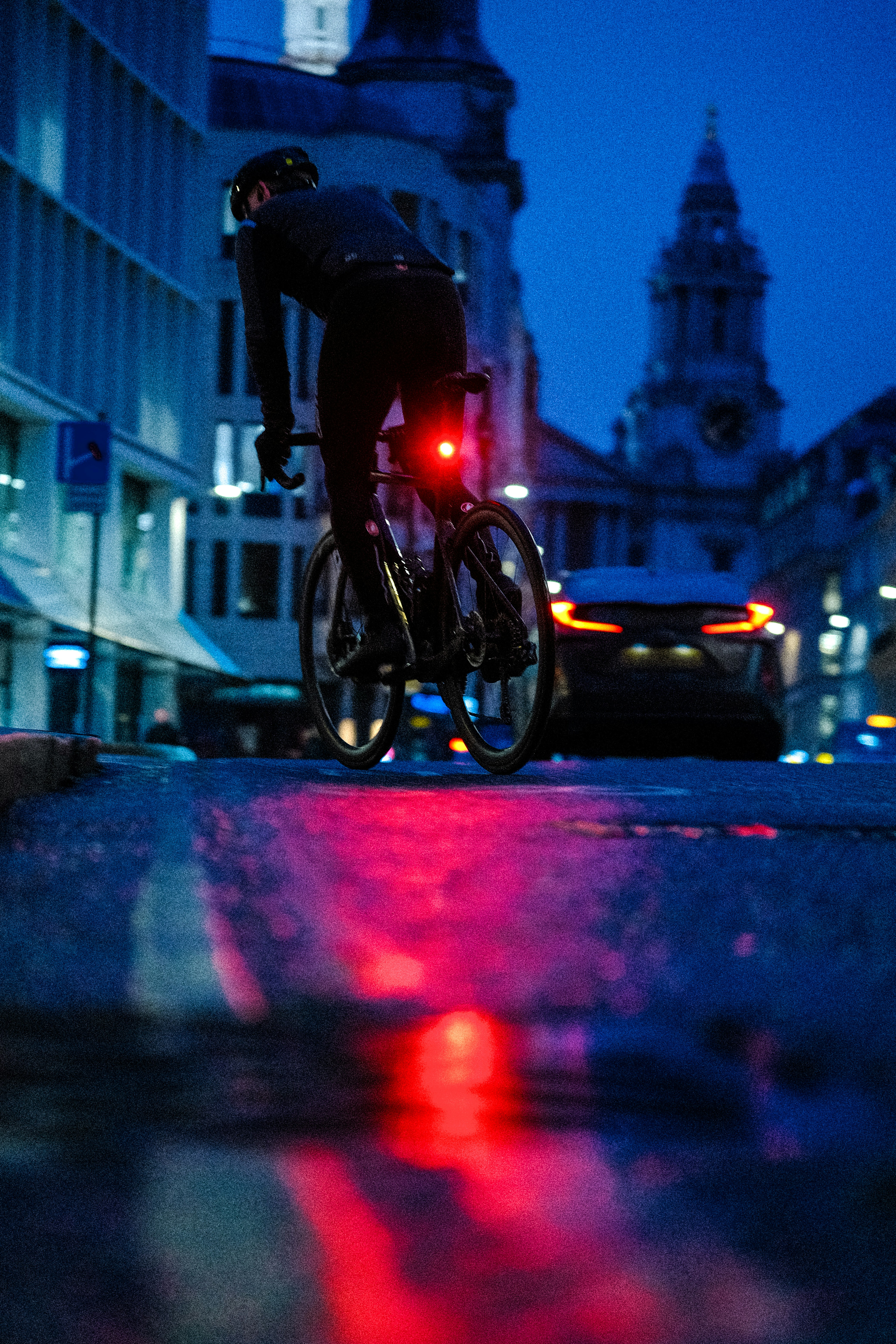 Midnight Urban Hop: Cyclist in Neon Blue
