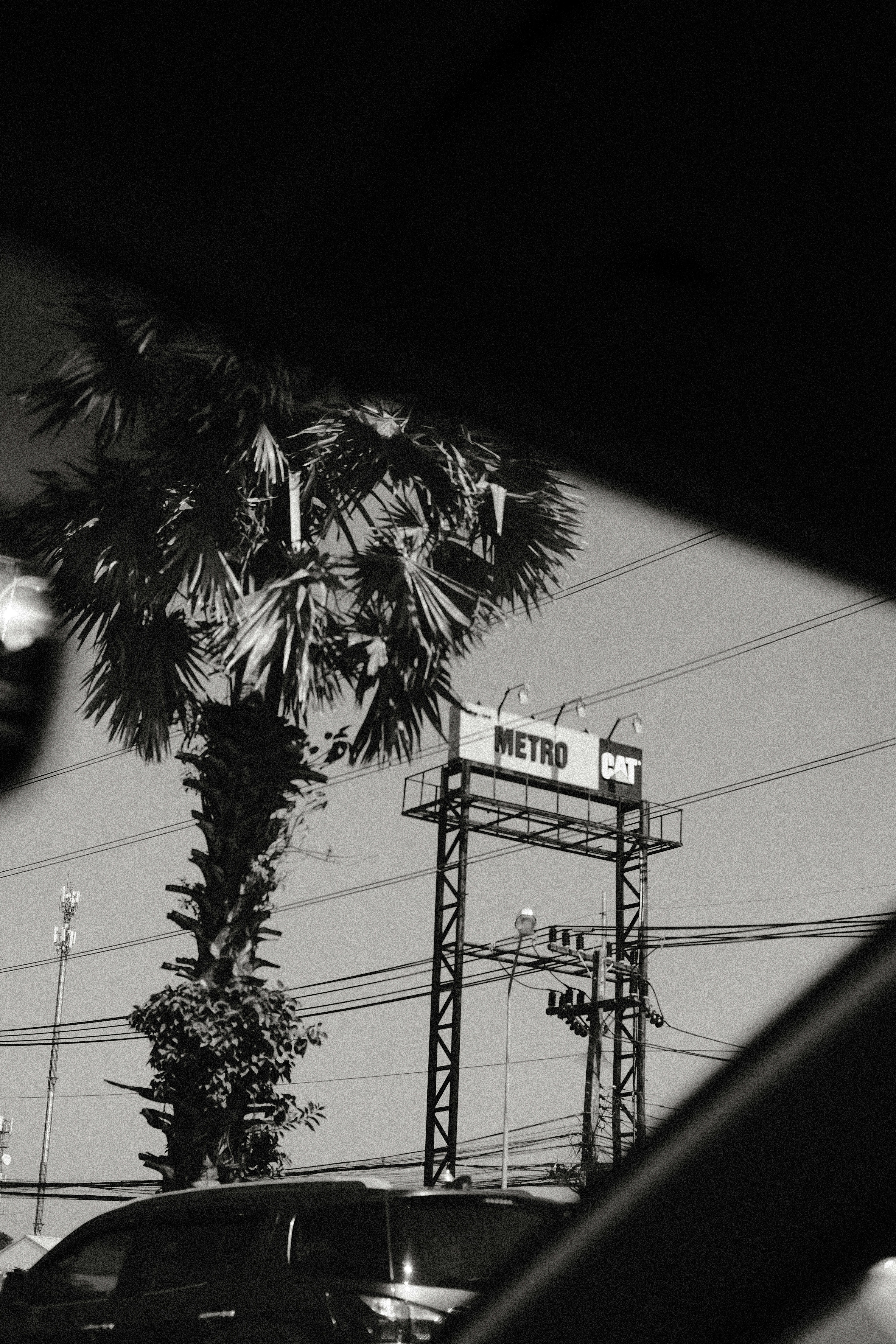 A black and white photo of a street sign
