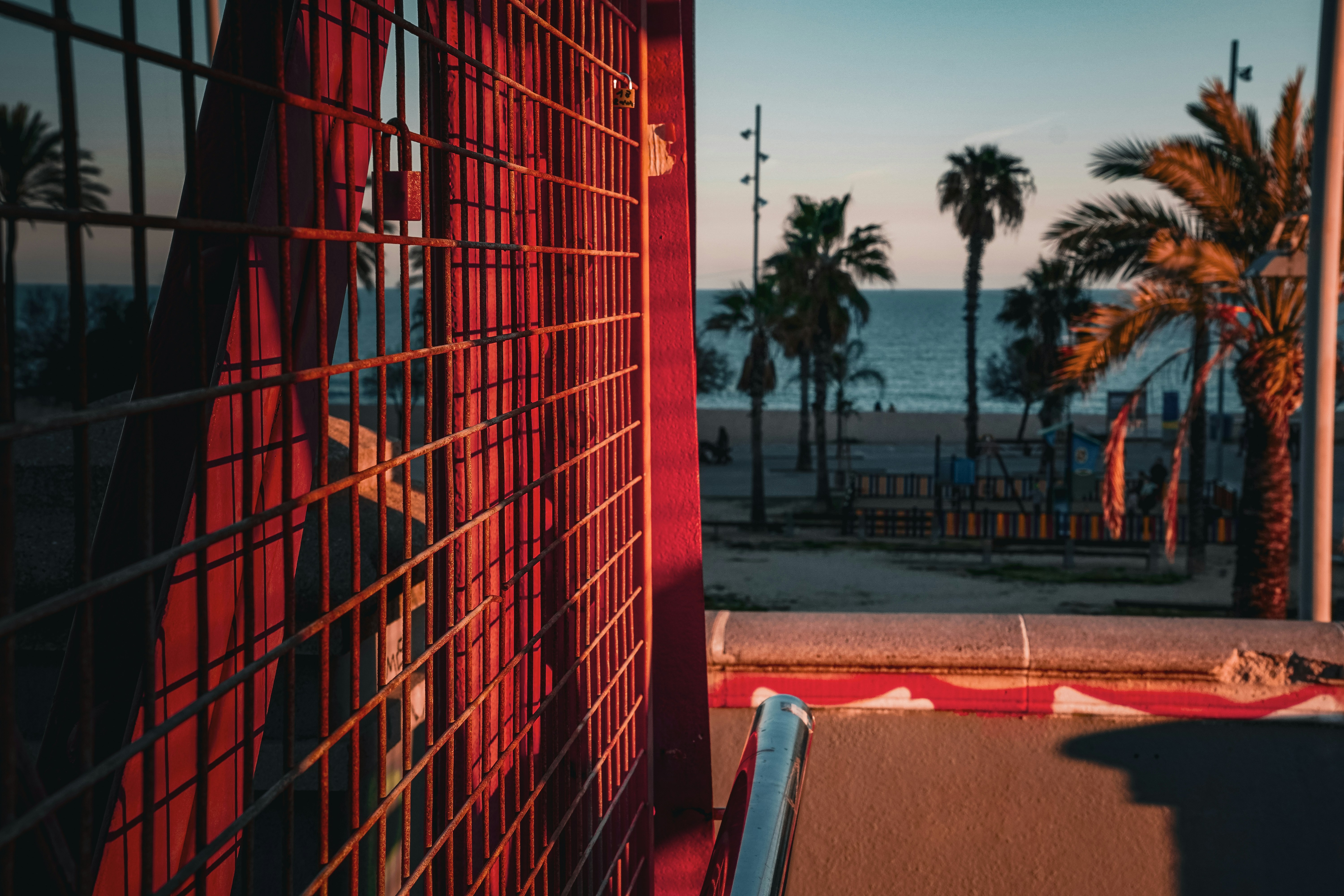 Crimson Lattice Framing the Sunset Beachfront