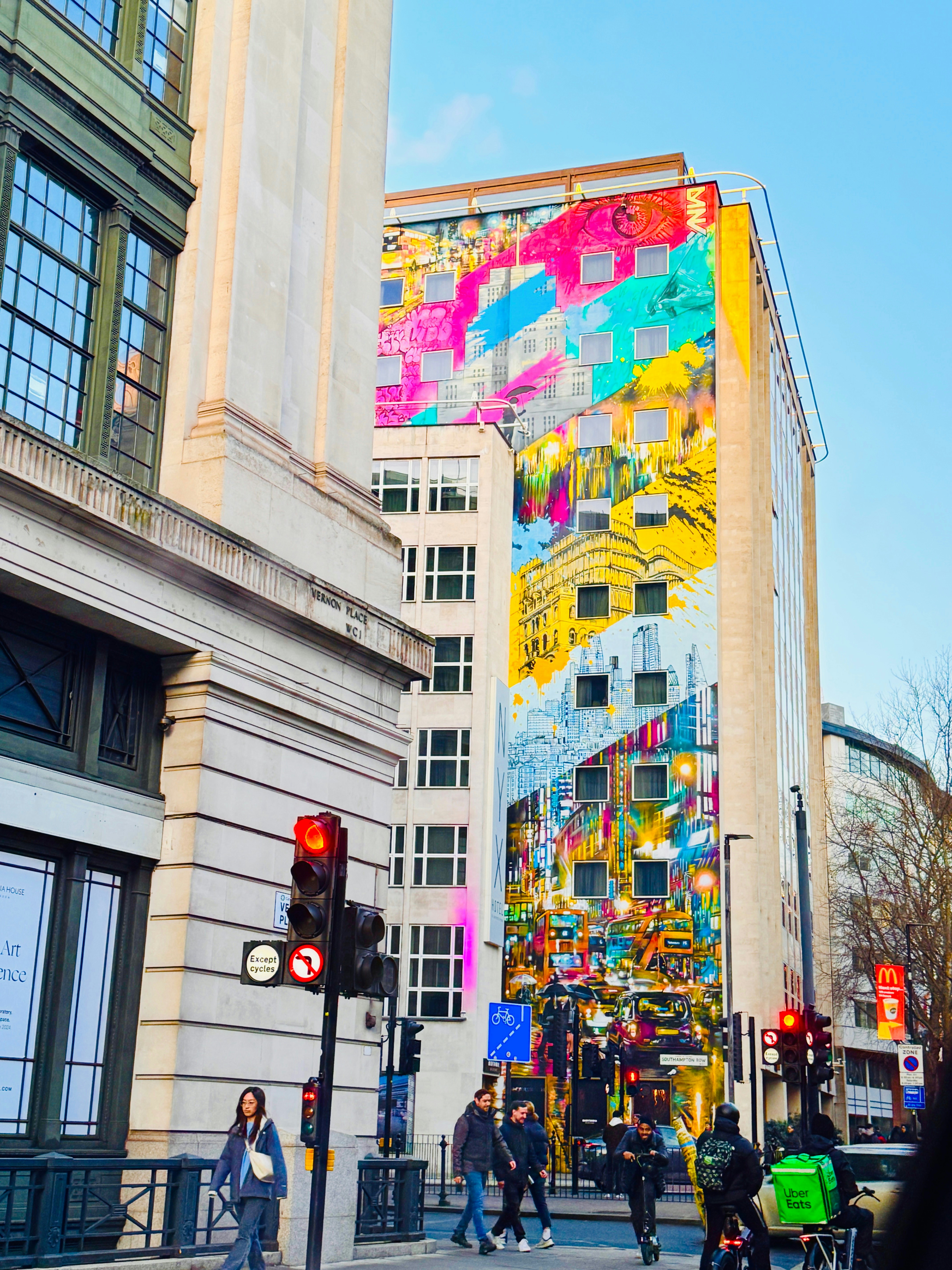 A large building with a colorful mural on the side of it