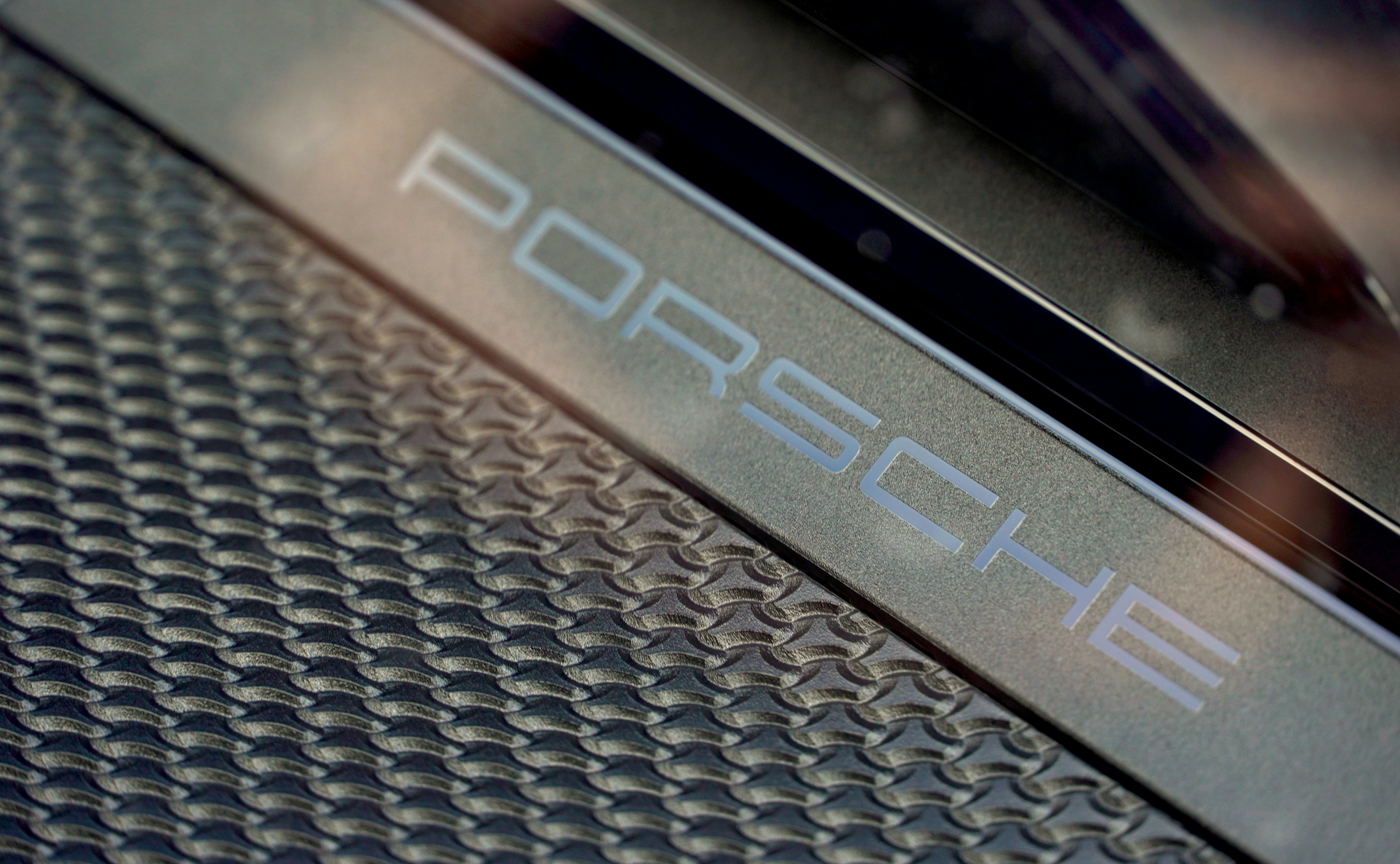 Porsche Script on Diamond-Textured Panel: A Macro Portrait of Precision