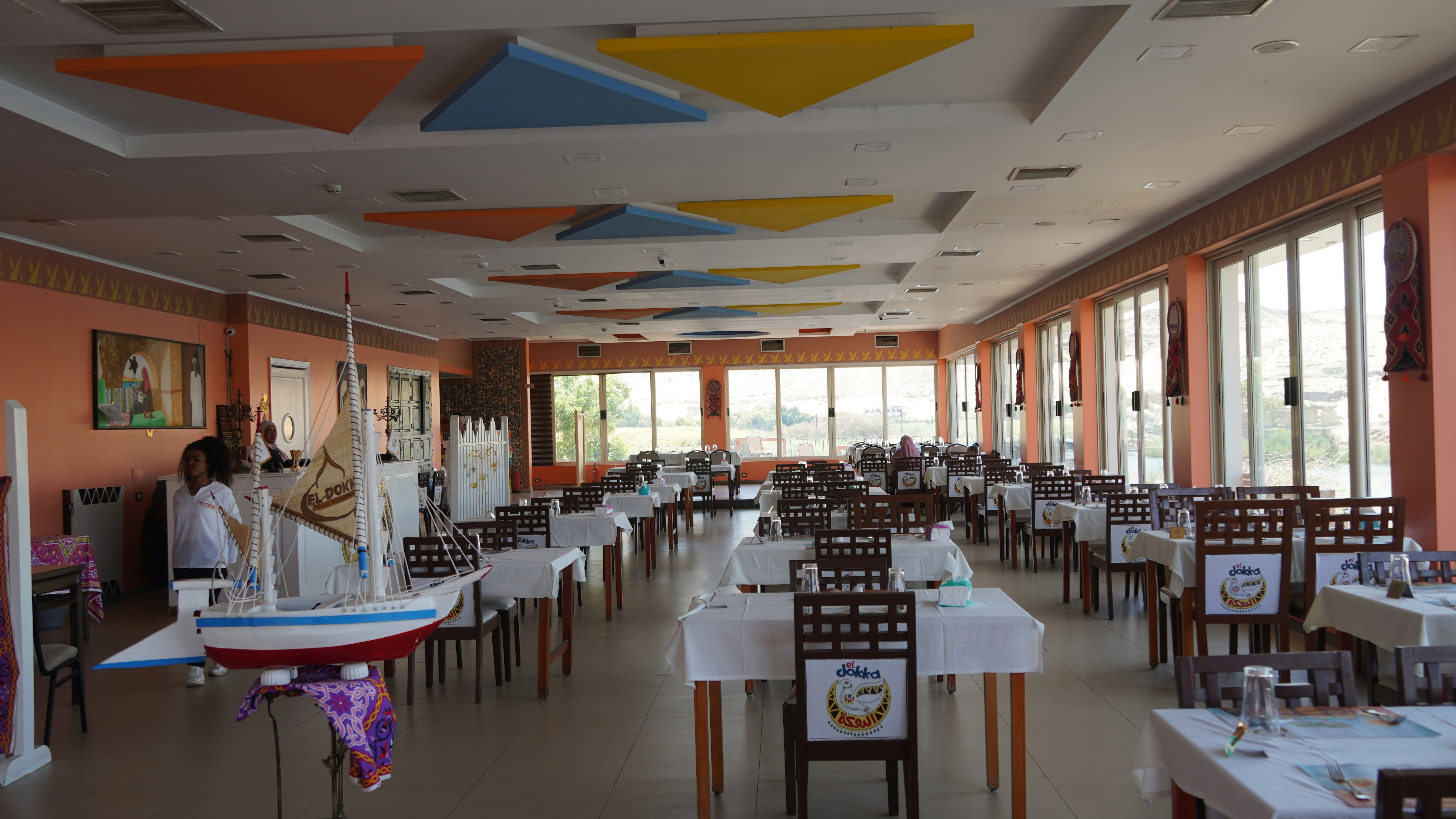 Dockside Model Boat Anchors a Sunlit Banquet Hall
