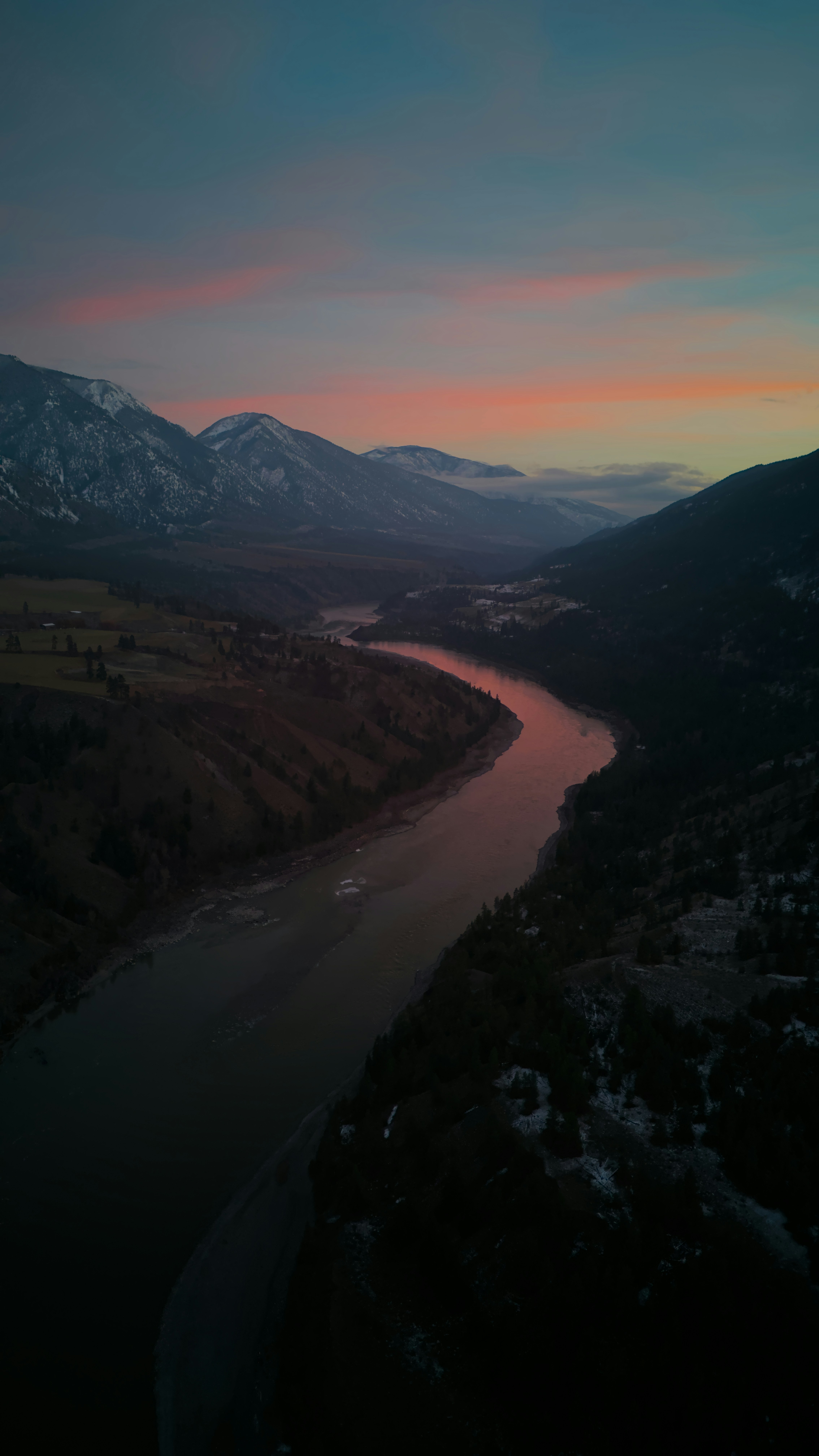 Ember-Washed Valley: Sunset Ribbon over Snow-Kissed Peaks