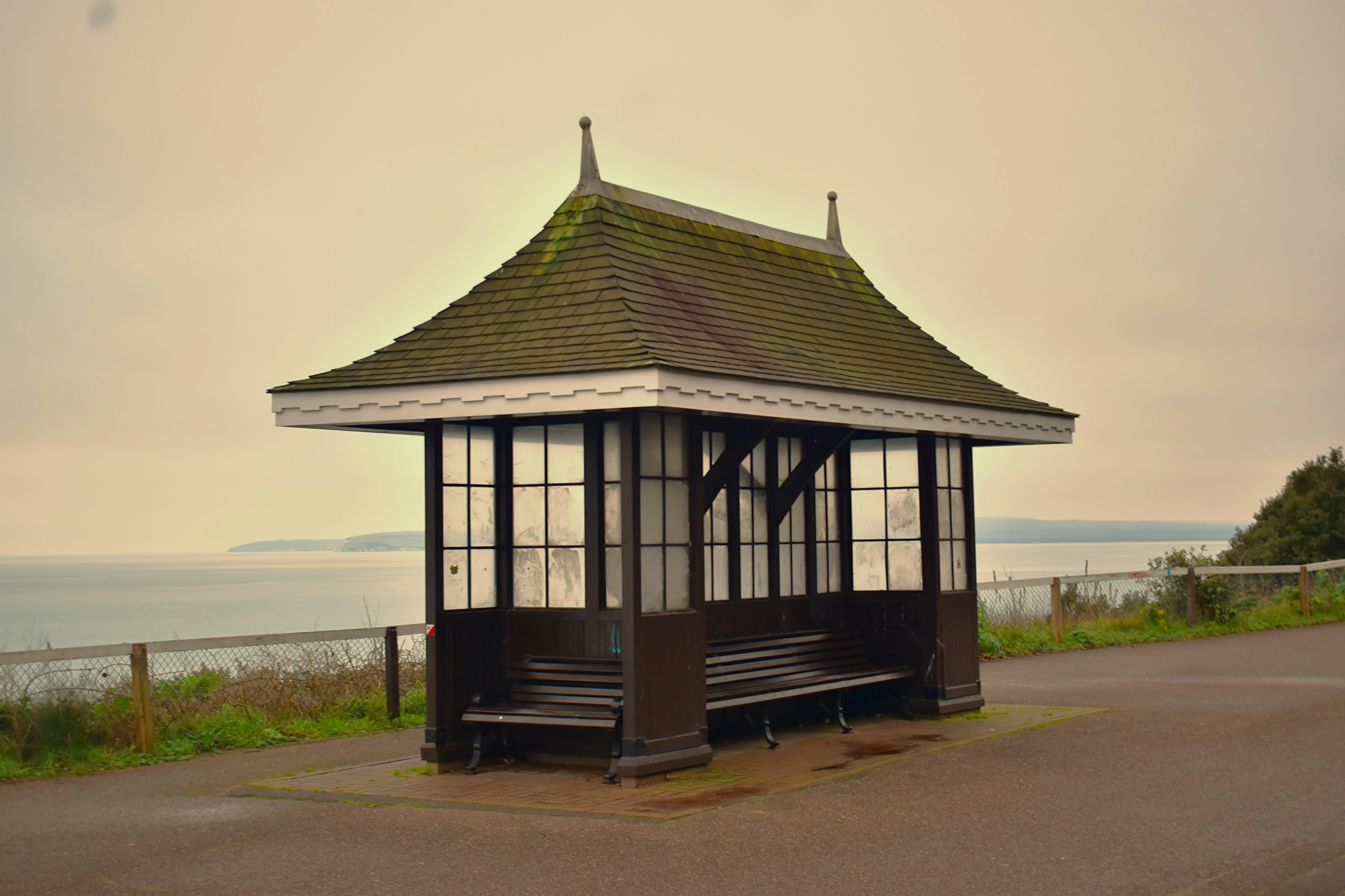 Harborview Shelter: A Quiet Seaside Pavilion Framed by Distant Waves