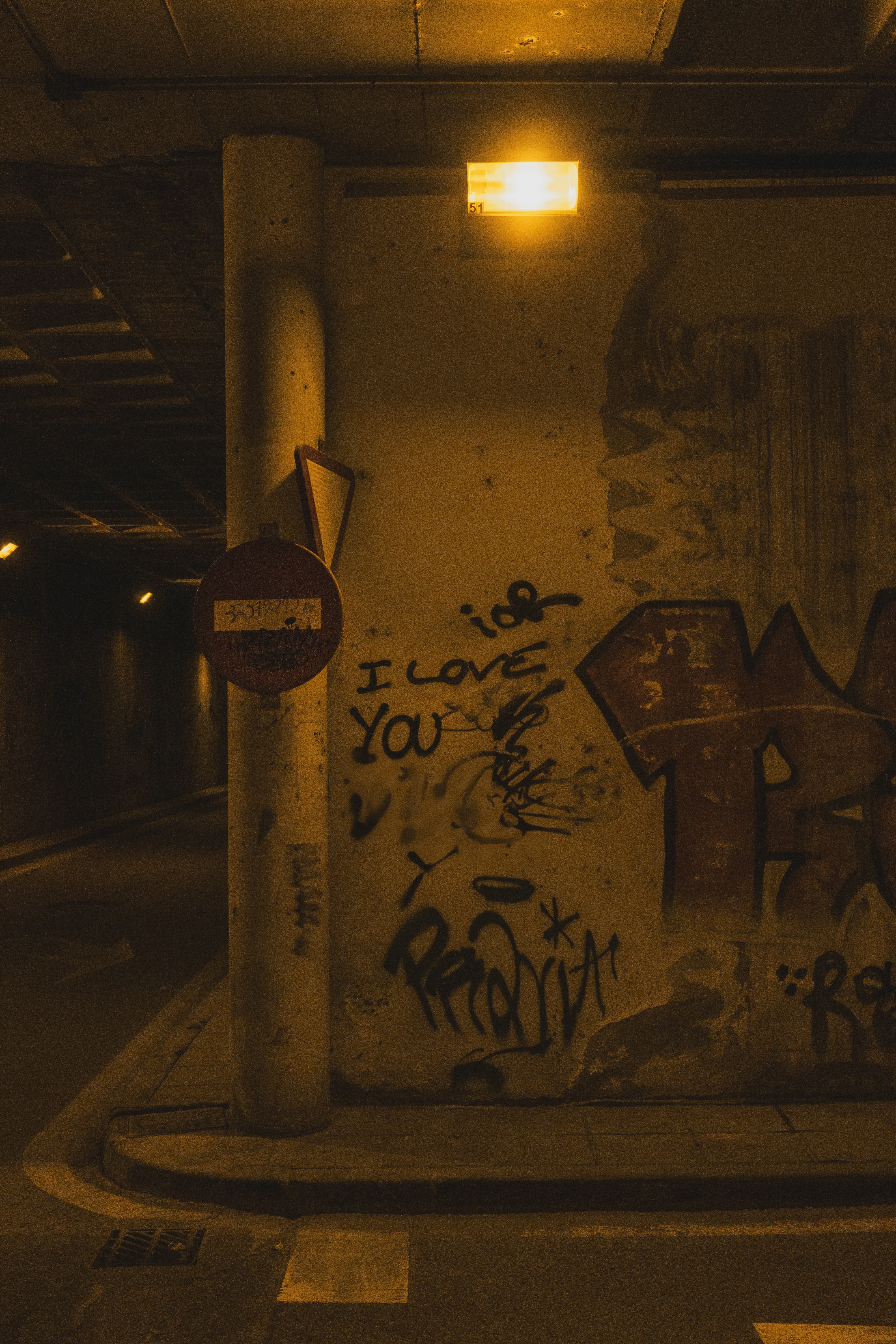 Amber Halo Over a Graffiti-Laden Underpass