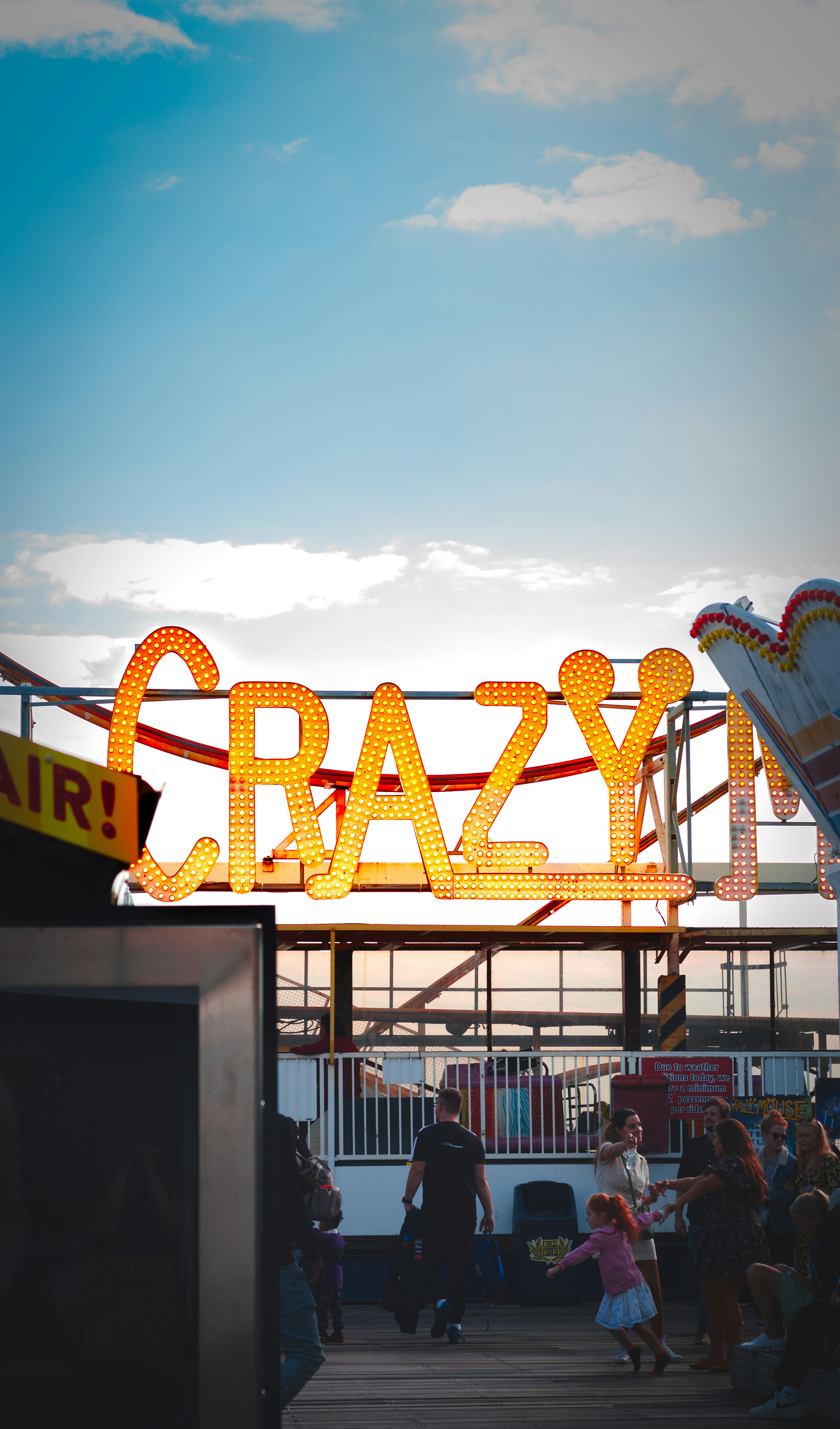 A sign that says crazy on a carnival ride photo – Free Brighton Image ...