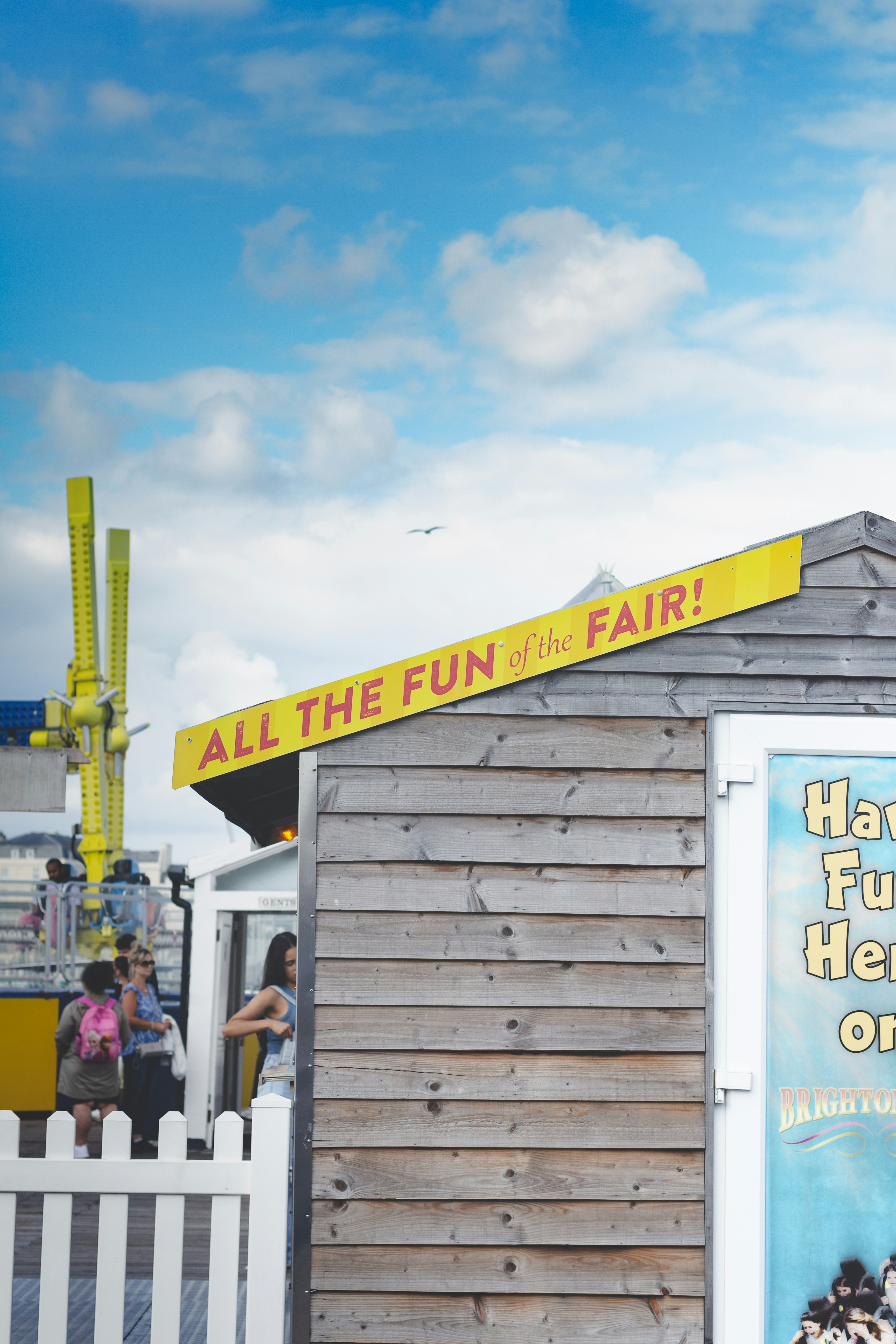 Banner of Fun at a Weathered Fairfront Under a Bright Coastal Sky