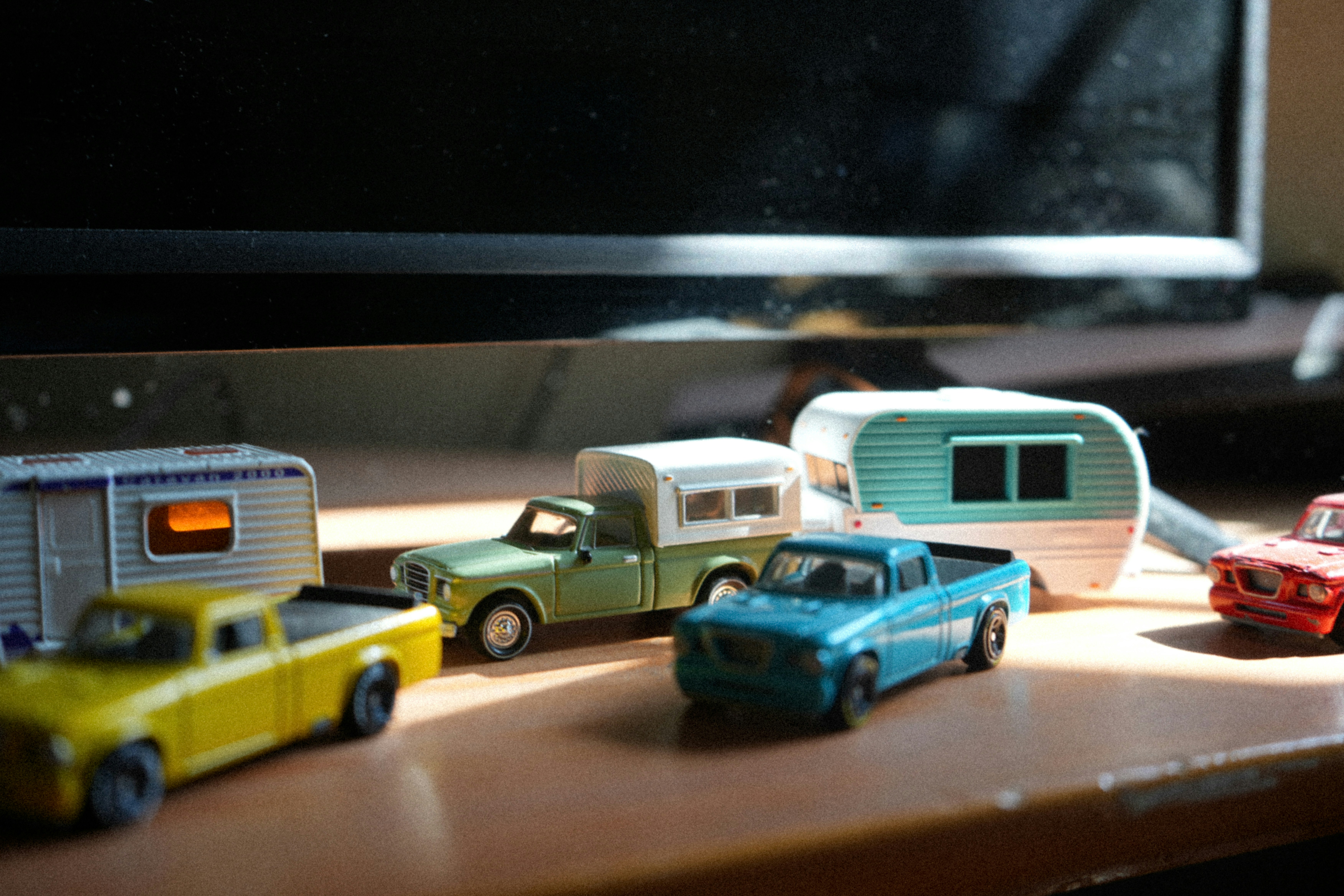 A group of toy cars sitting on top of a wooden table photo – Free Car ...