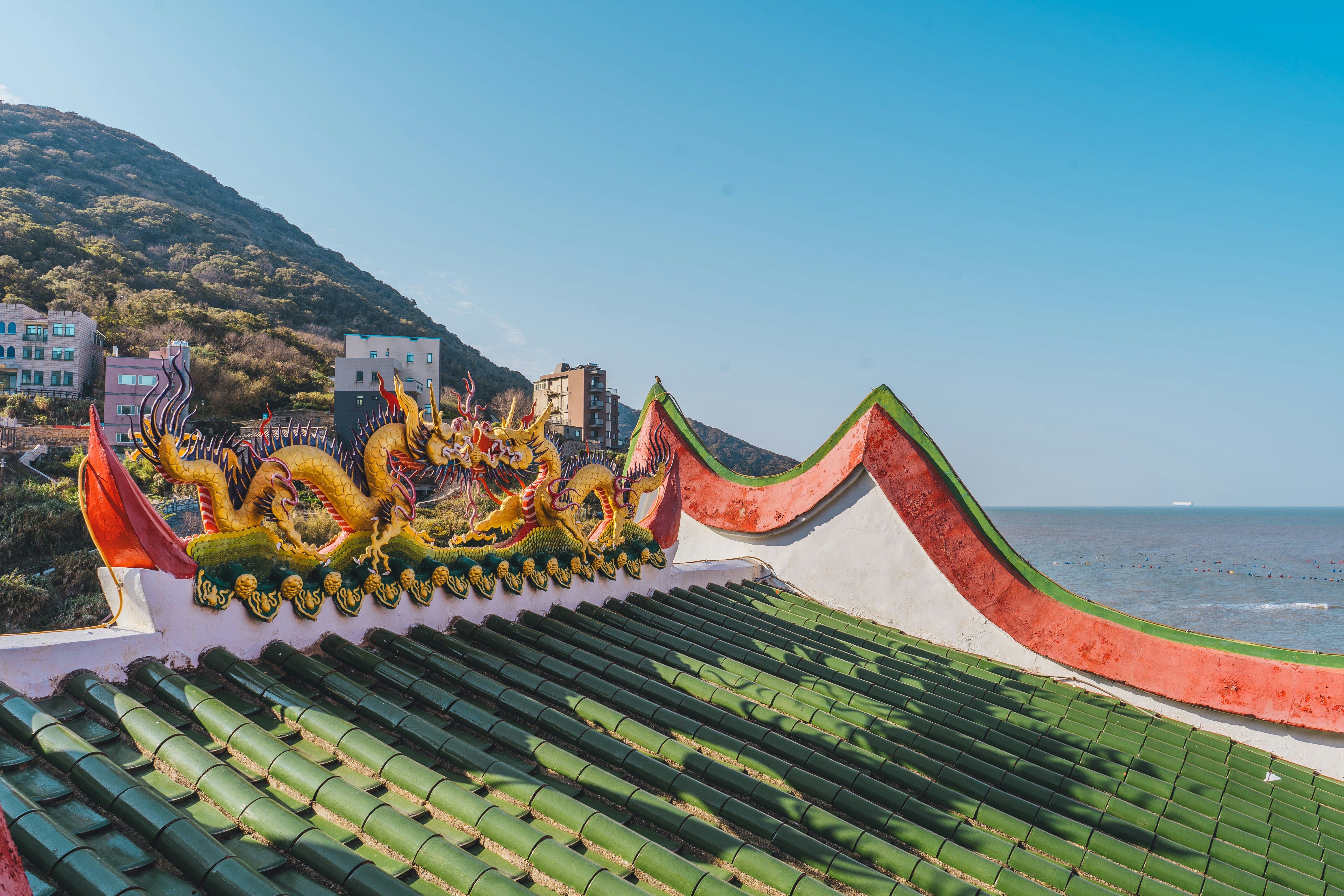 Dragon Crest Over Ocean Rooftop