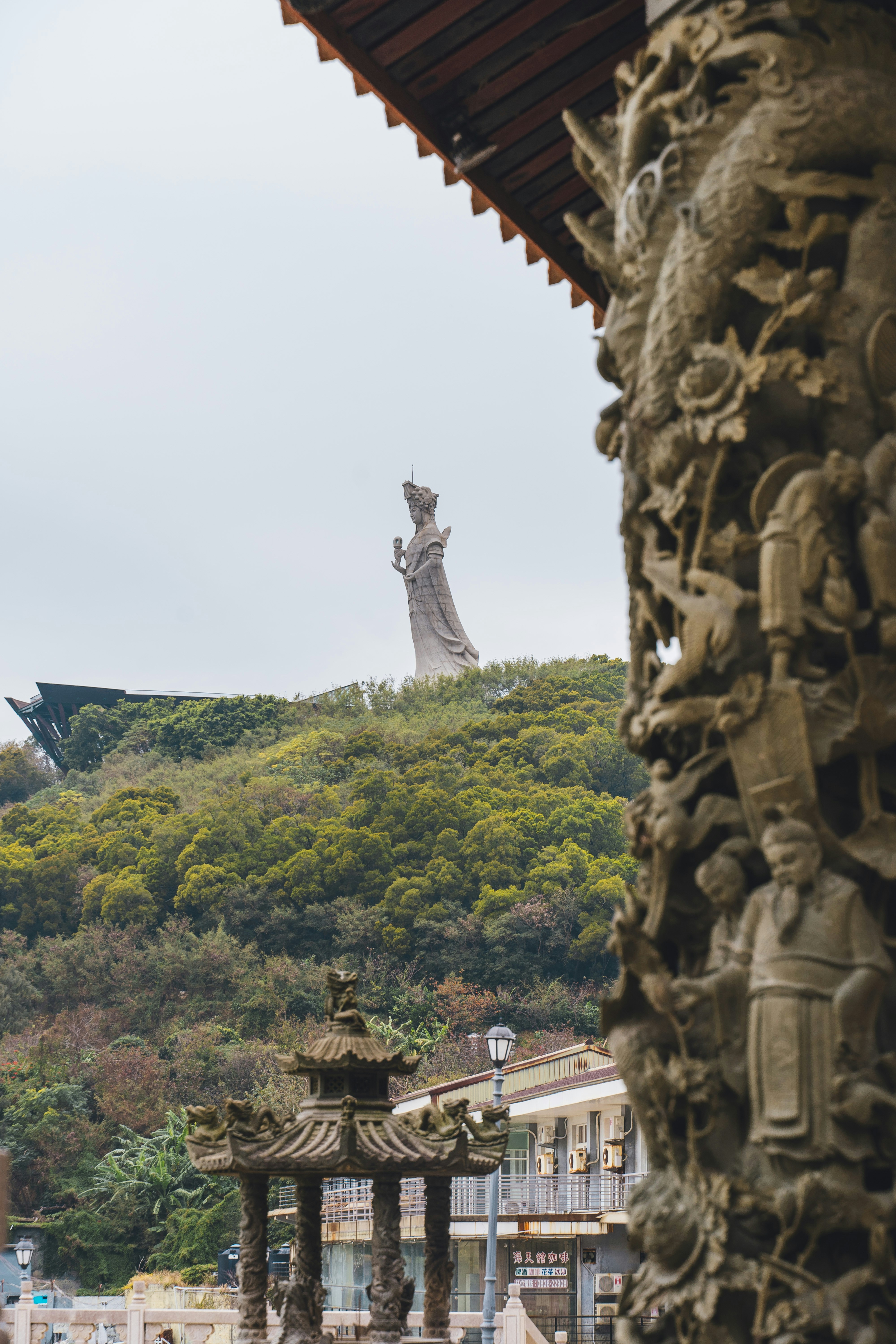 Hilltop Guardian Framed by Dragon-Carved Relics